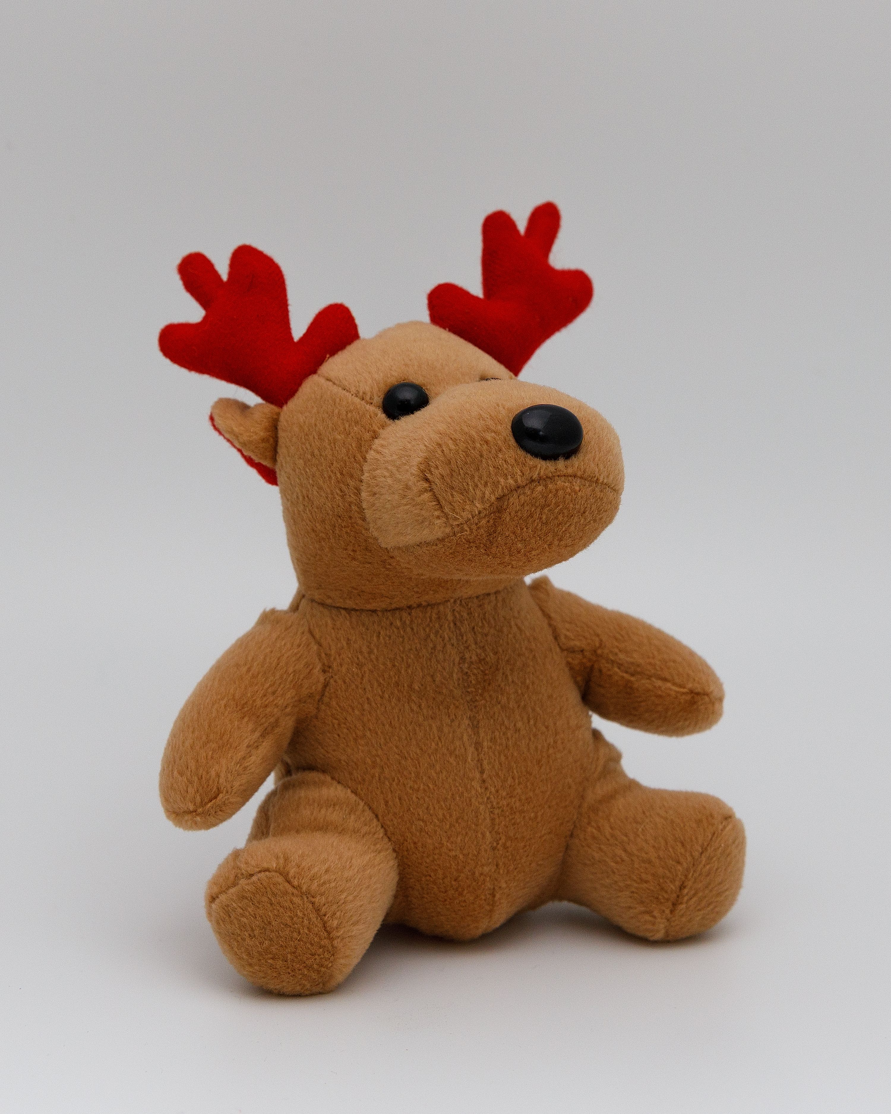Cute Plush Reindeer Toy with Red Antlers · Free Stock Photo
