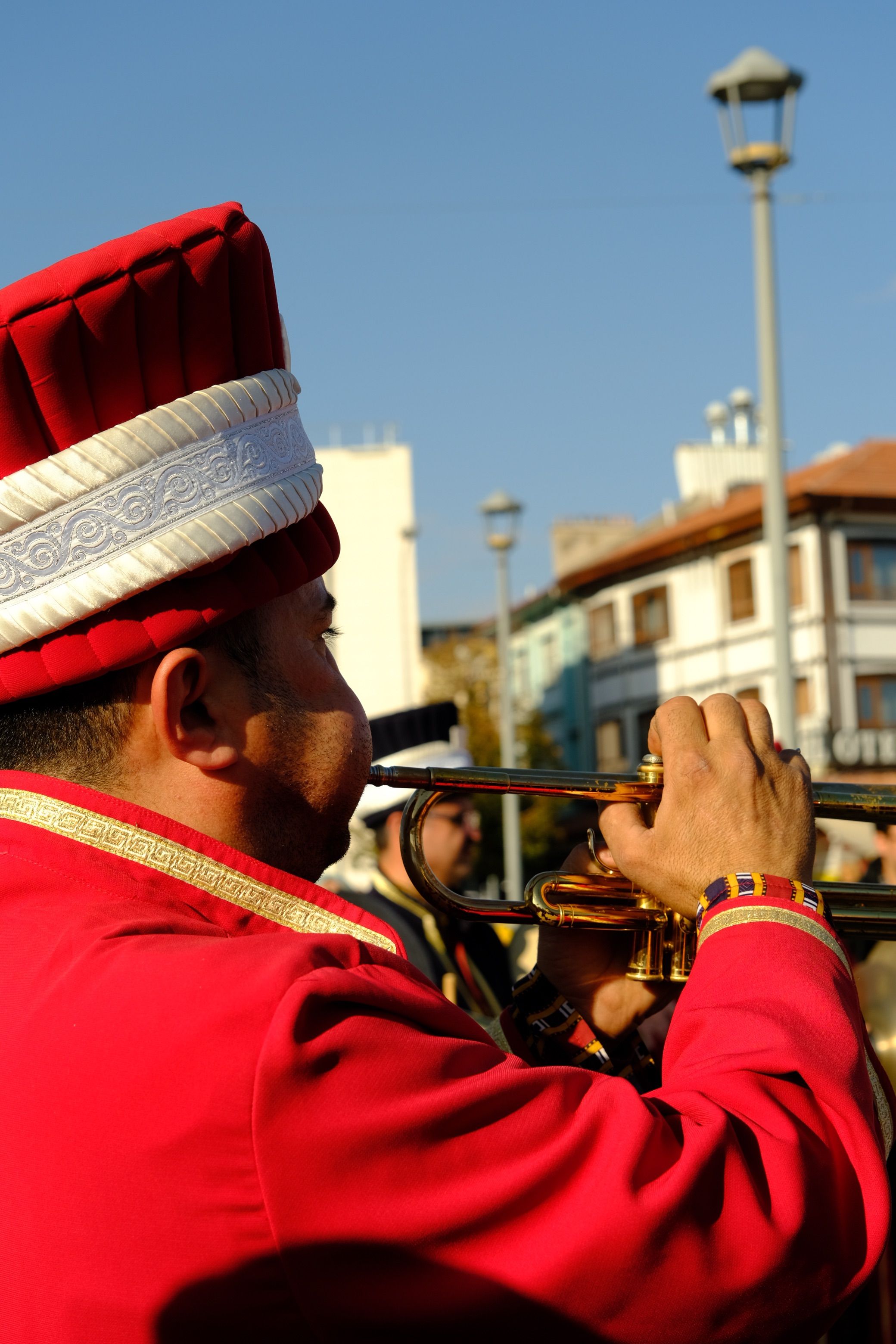 Traditional Musician in Colorful Attire Playing Trumpet · Free Stock Photo