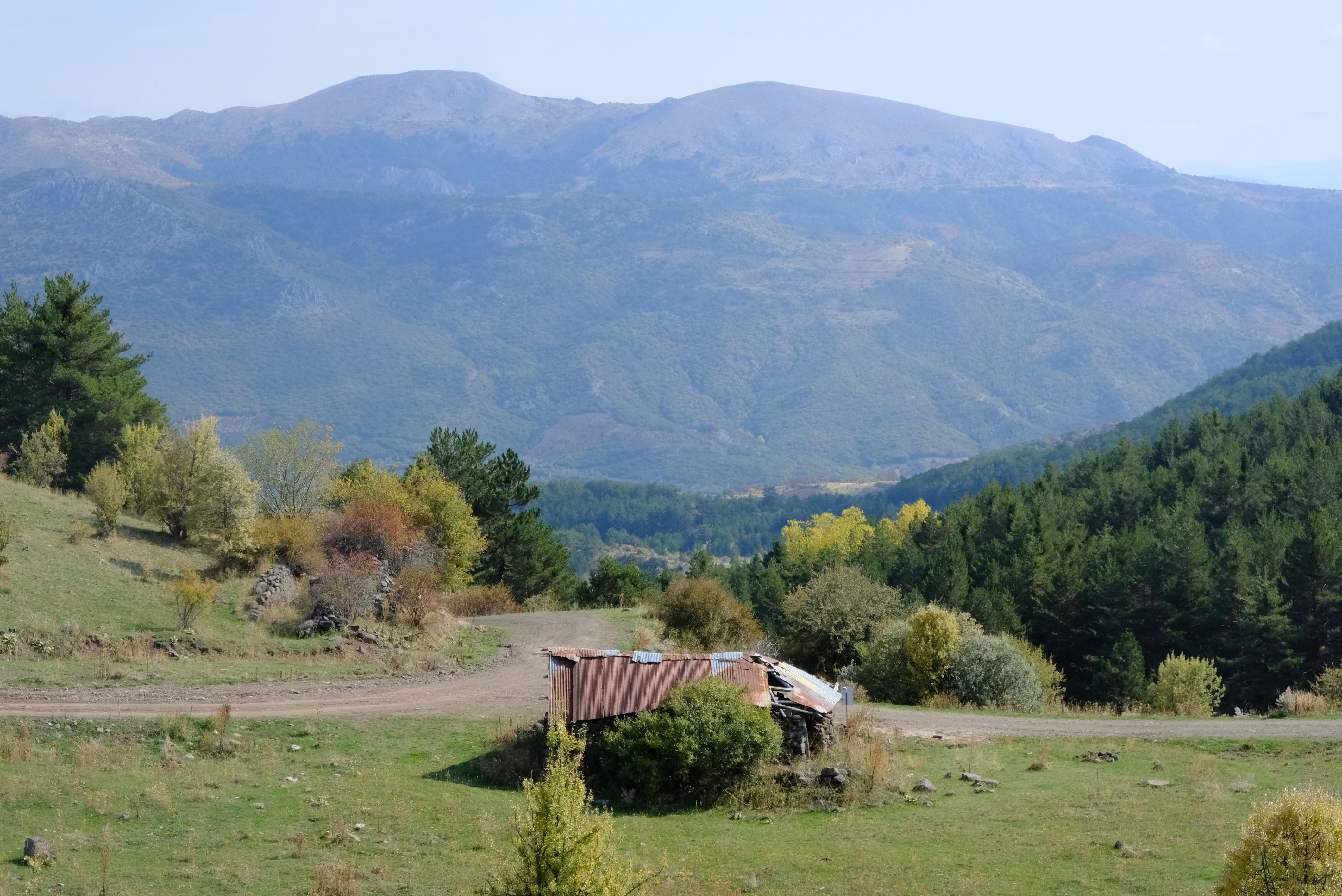 Scenic Mountain Landscape with Rustic Cabin · Free Stock Photo
