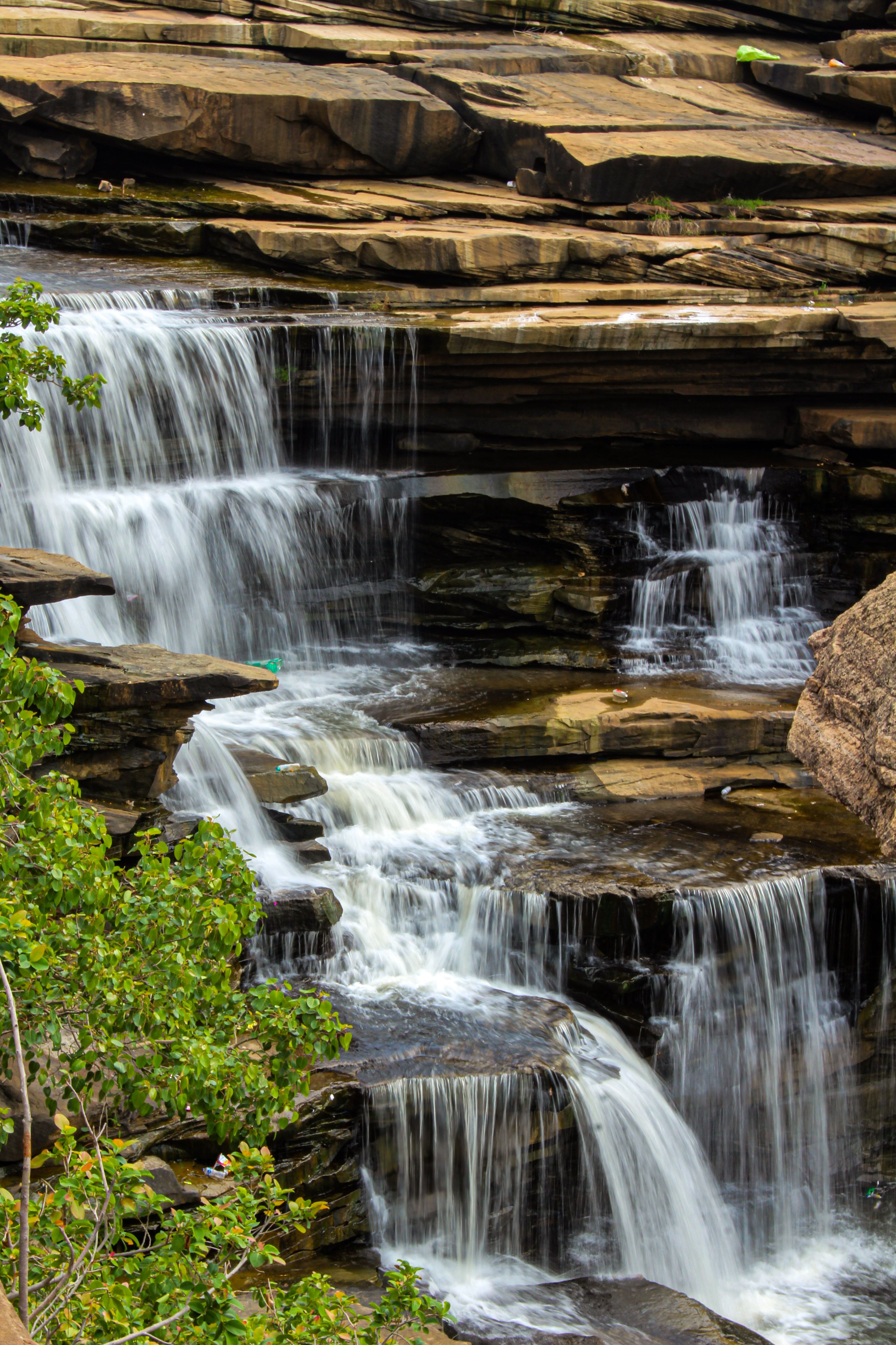 Stunning Tiered Waterfall in Lush Landscape · Free Stock Photo
