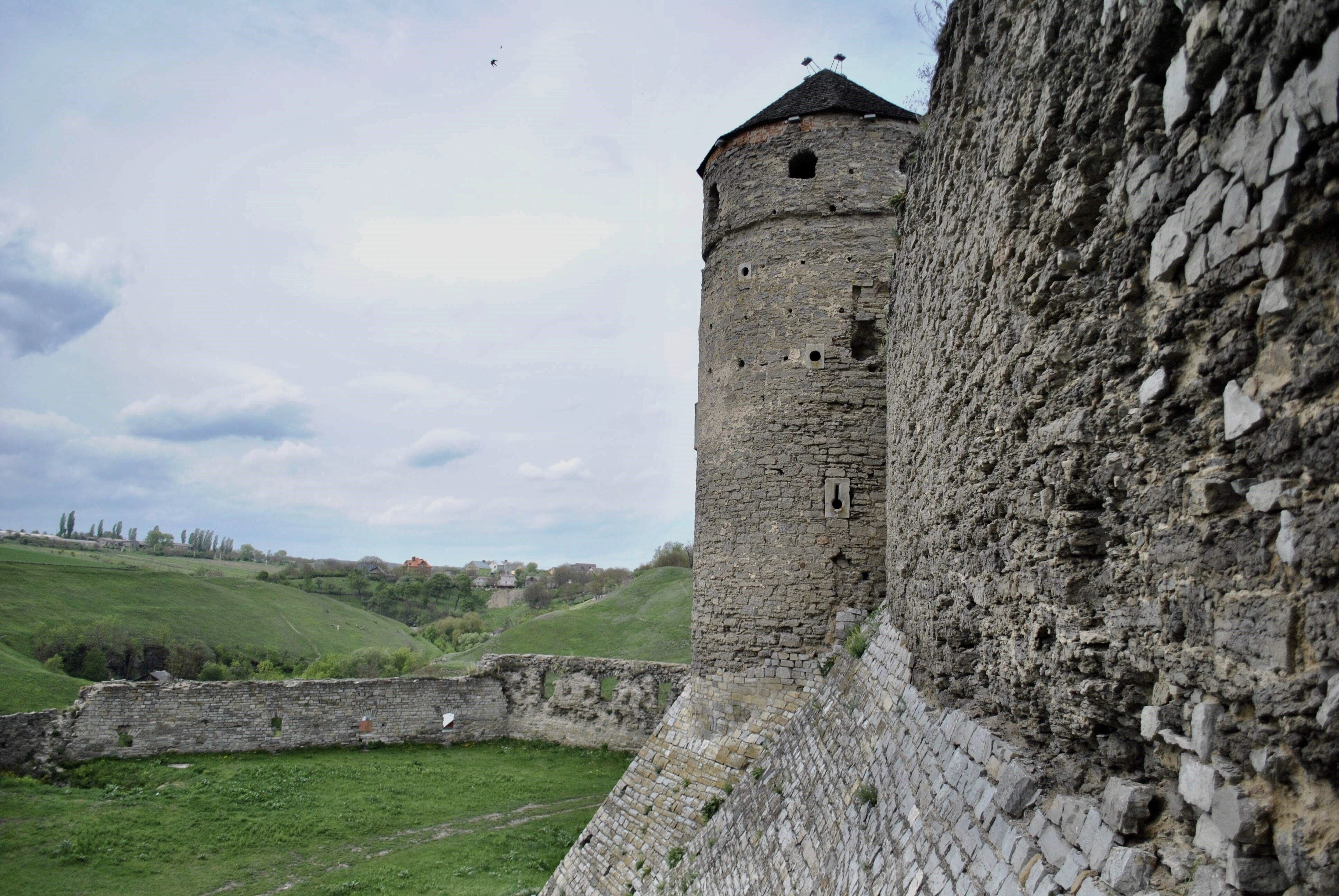 Historic Stone Fortress Tower in Scenic Landscape · Free Stock Photo