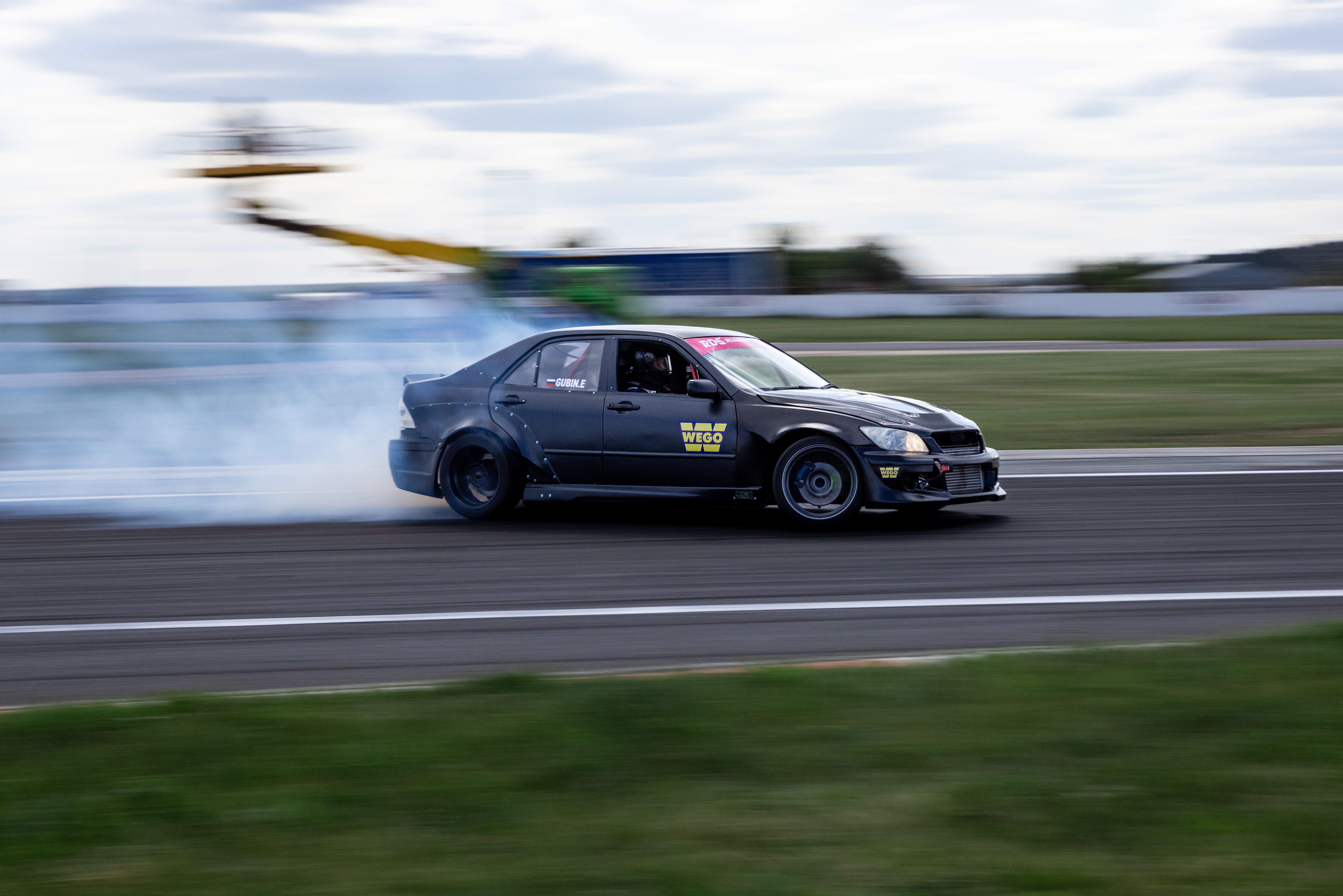 Dynamic BMW Drift Car on Race Track · Free Stock Photo
