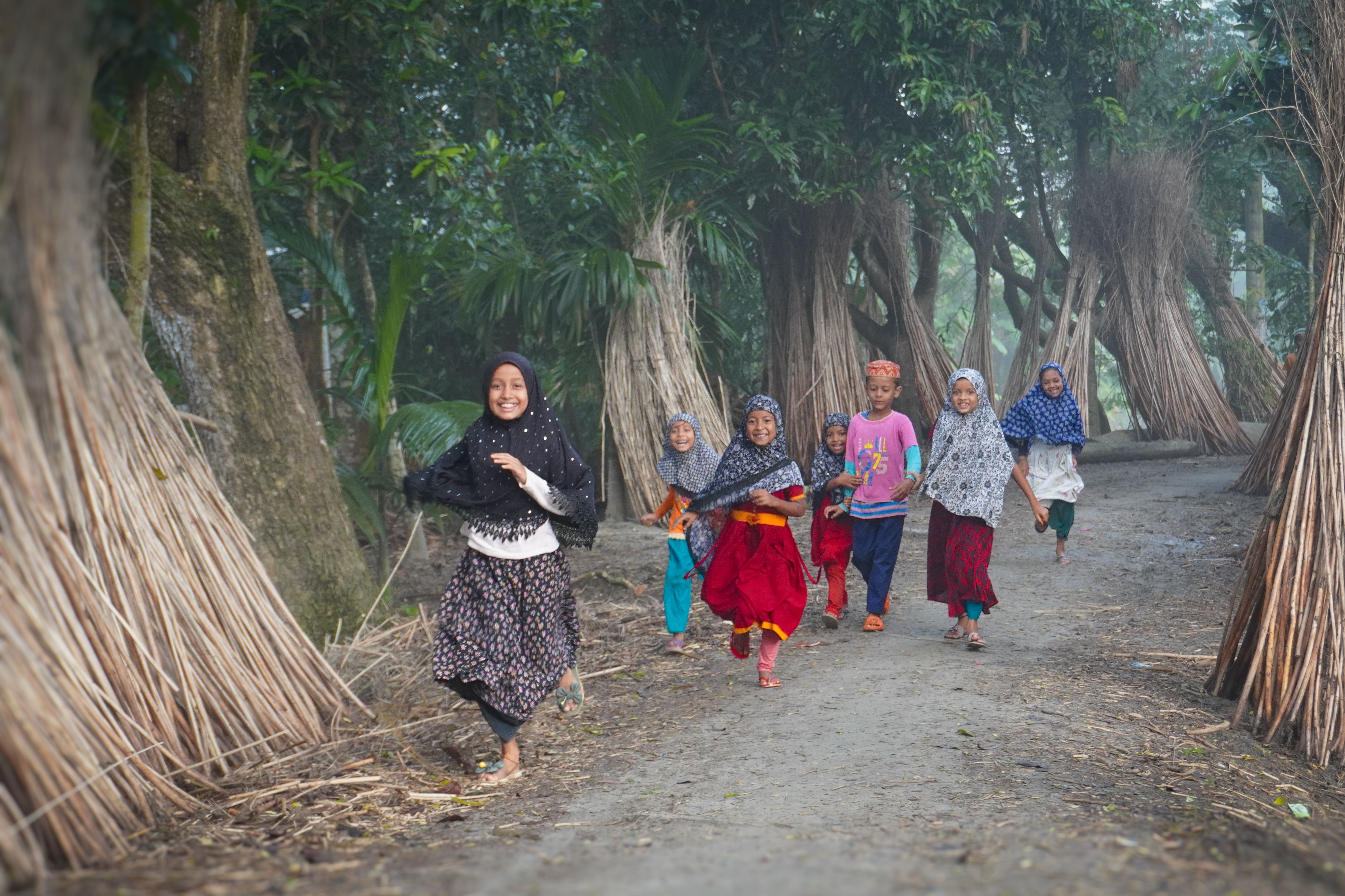 Children Running Joyfully in a Rural Village · Free Stock Photo