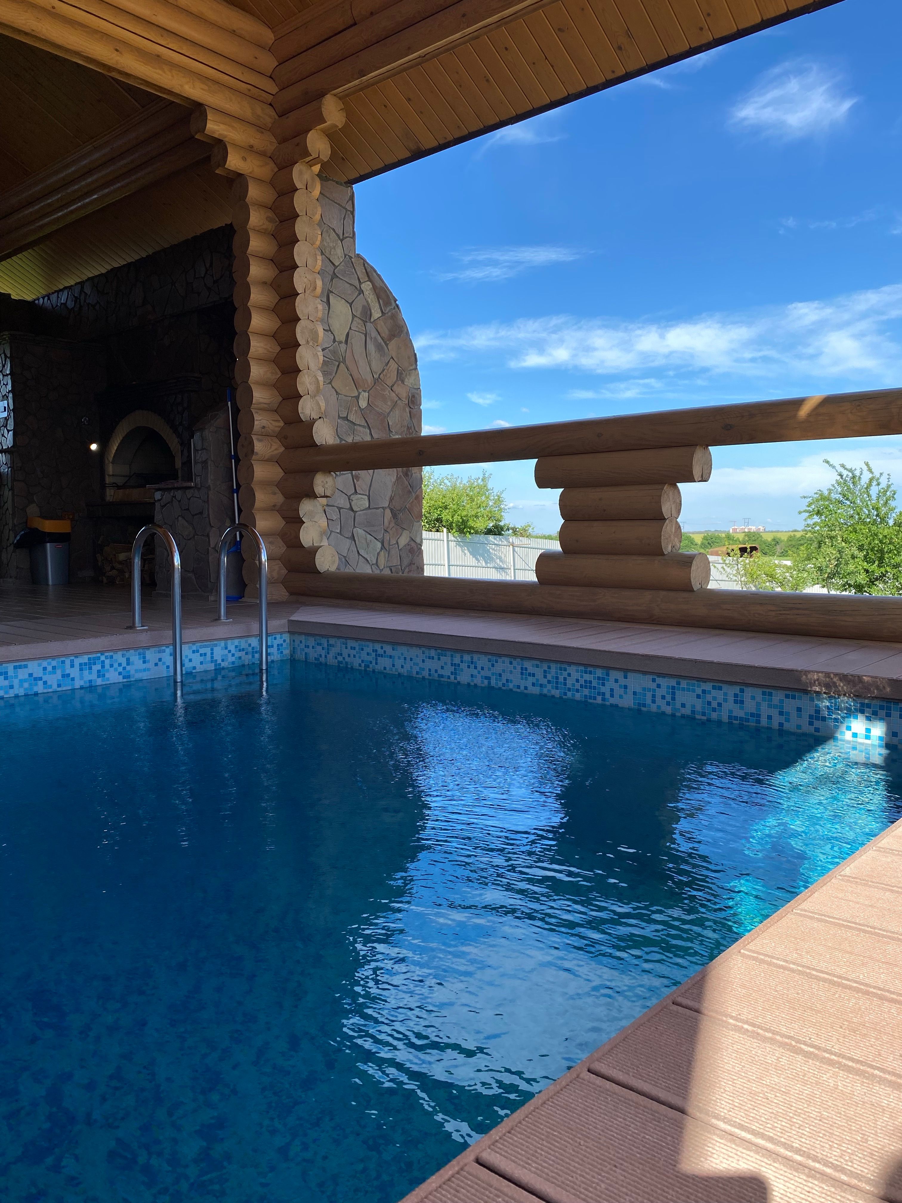 Tranquil Indoor Pool with Scenic Outdoor View · Free Stock Photo