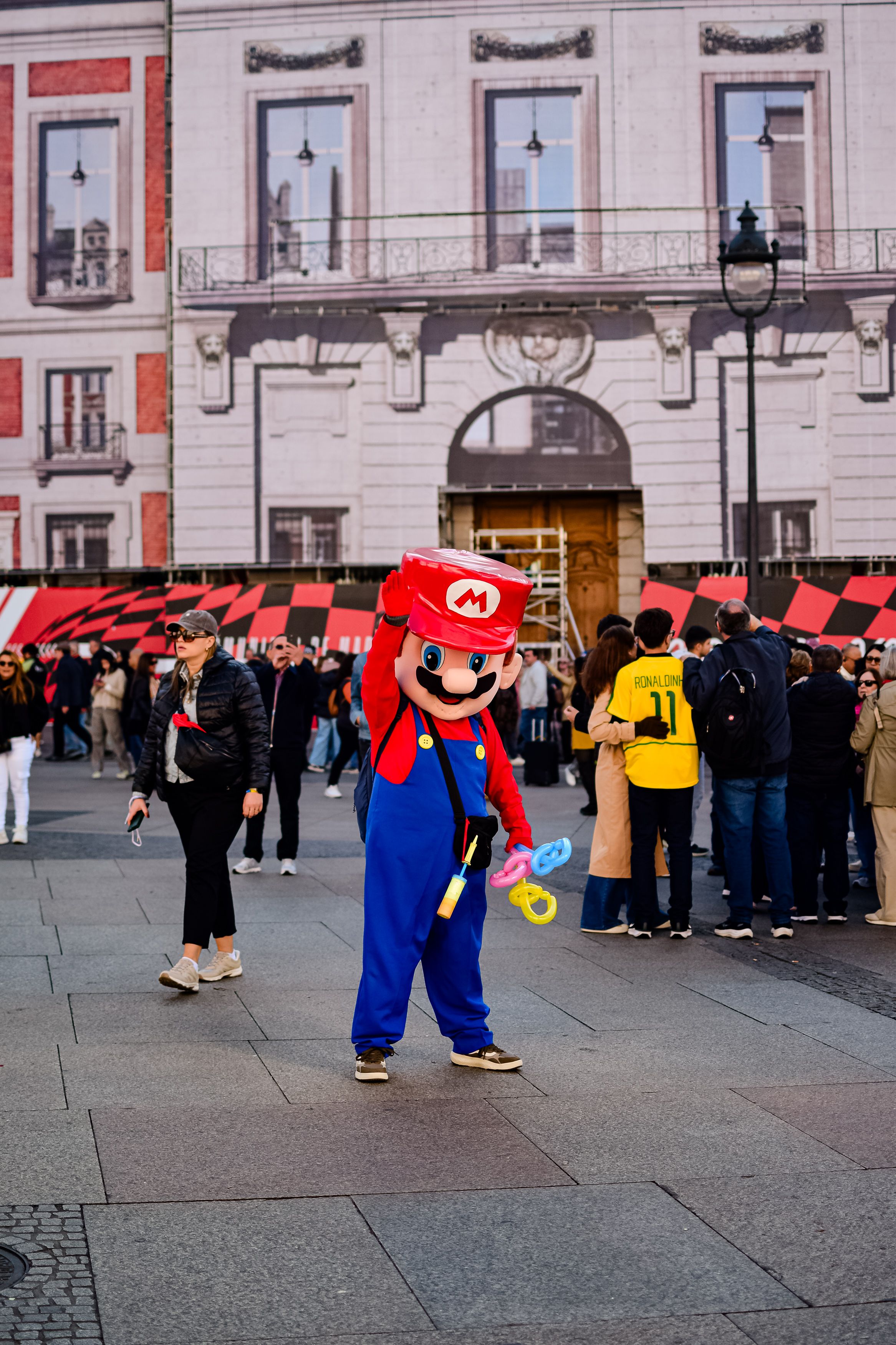 Street Performer in Vibrant Costume Entertains Crowd · Free Stock Photo