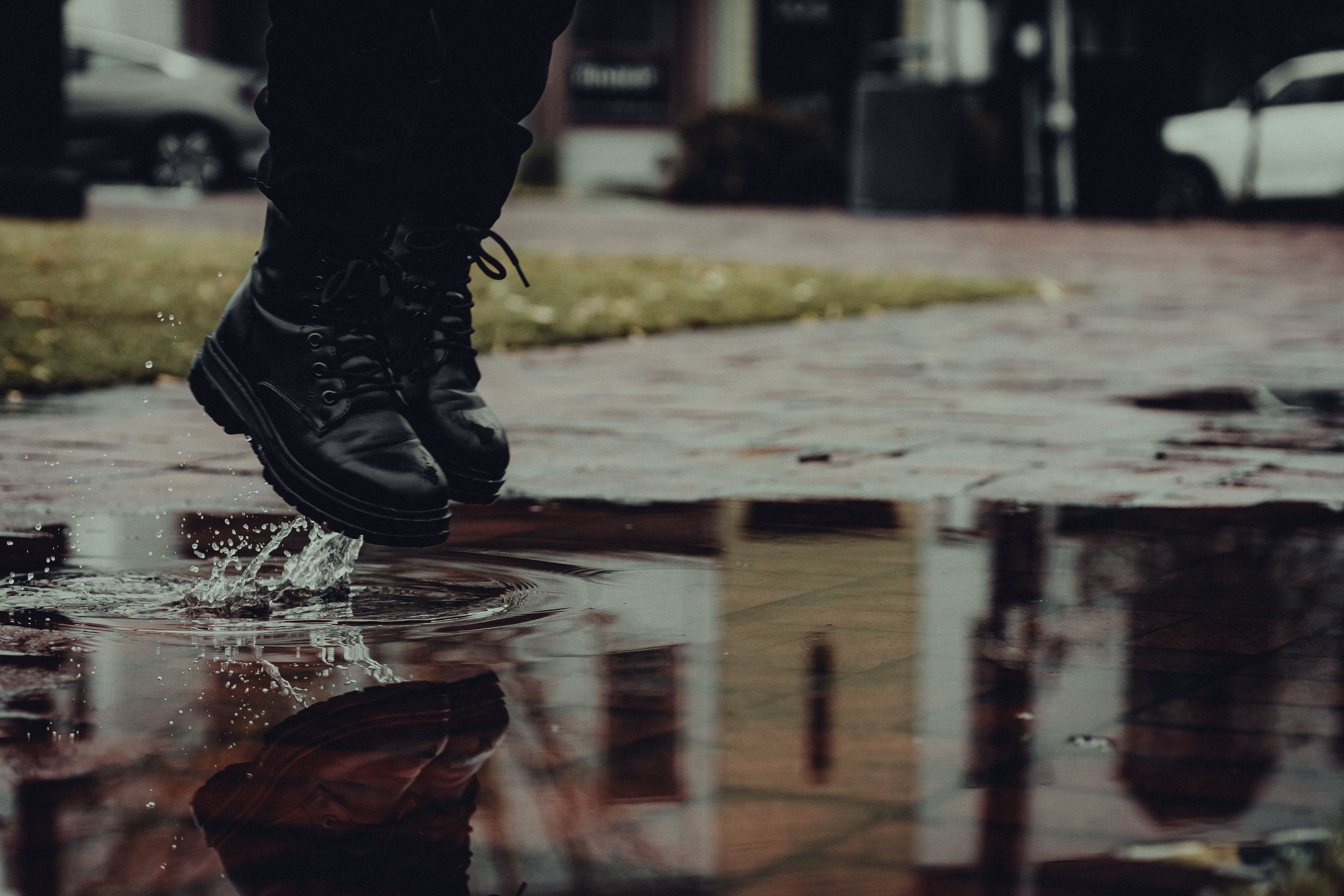 Jumping into a Puddle on a Rainy Day · Free Stock Photo