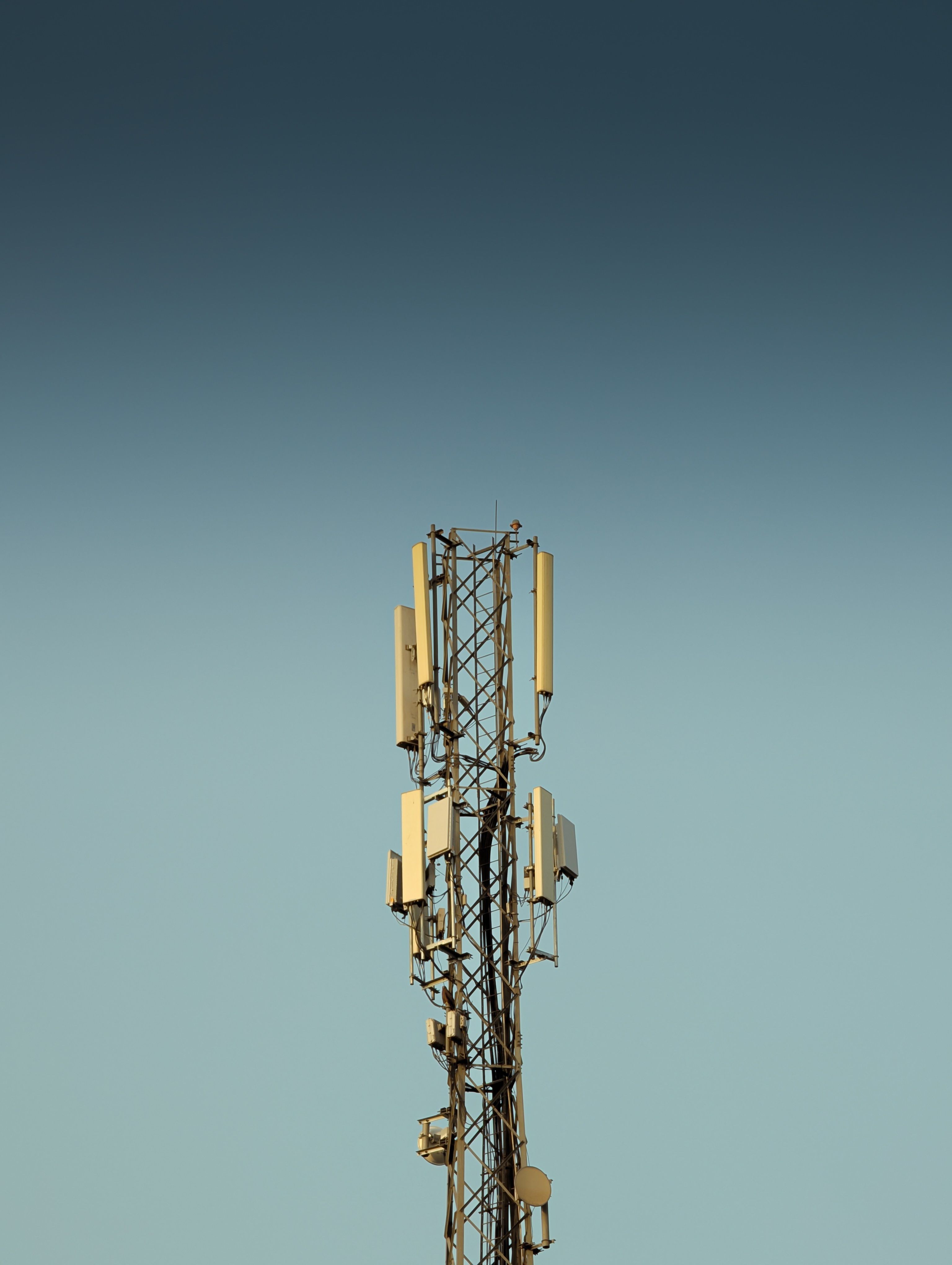 Cell Tower Against Clear Blue Sky in Rawalpindi · Free Stock Photo