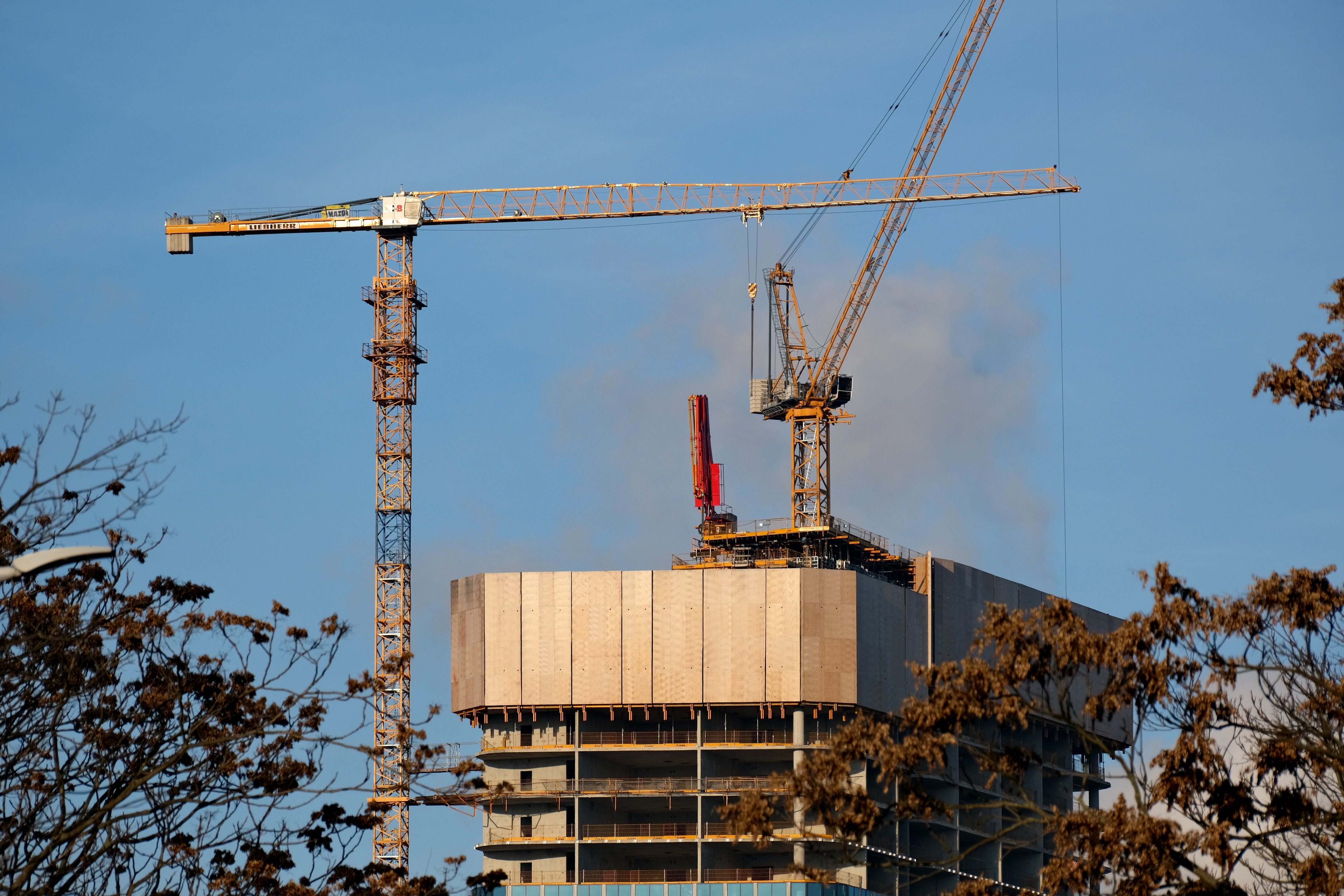 Tower Construction Under Blue Sky with Cranes · Free Stock Photo