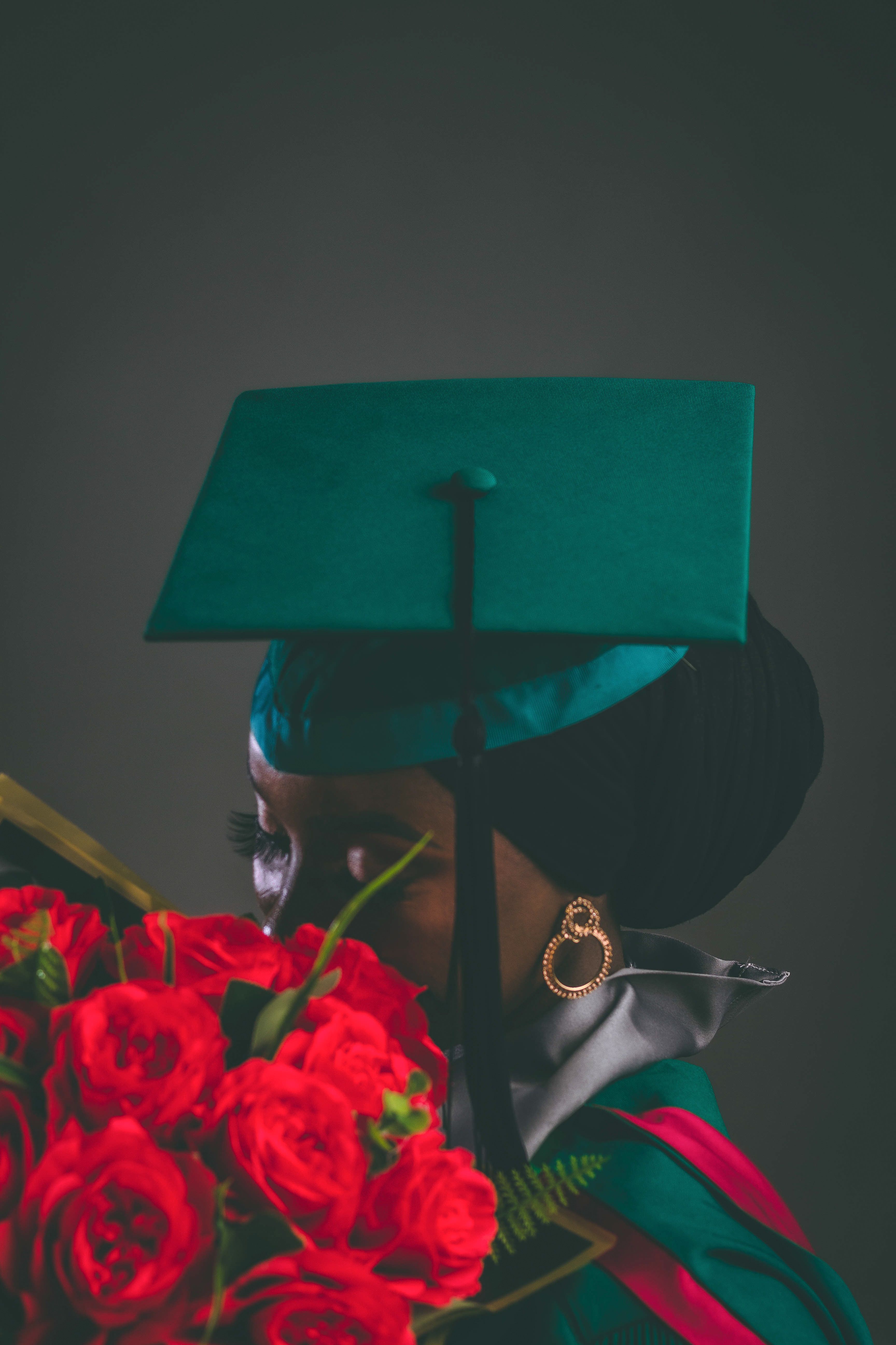 Elegant Graduation Portrait with Roses · Free Stock Photo