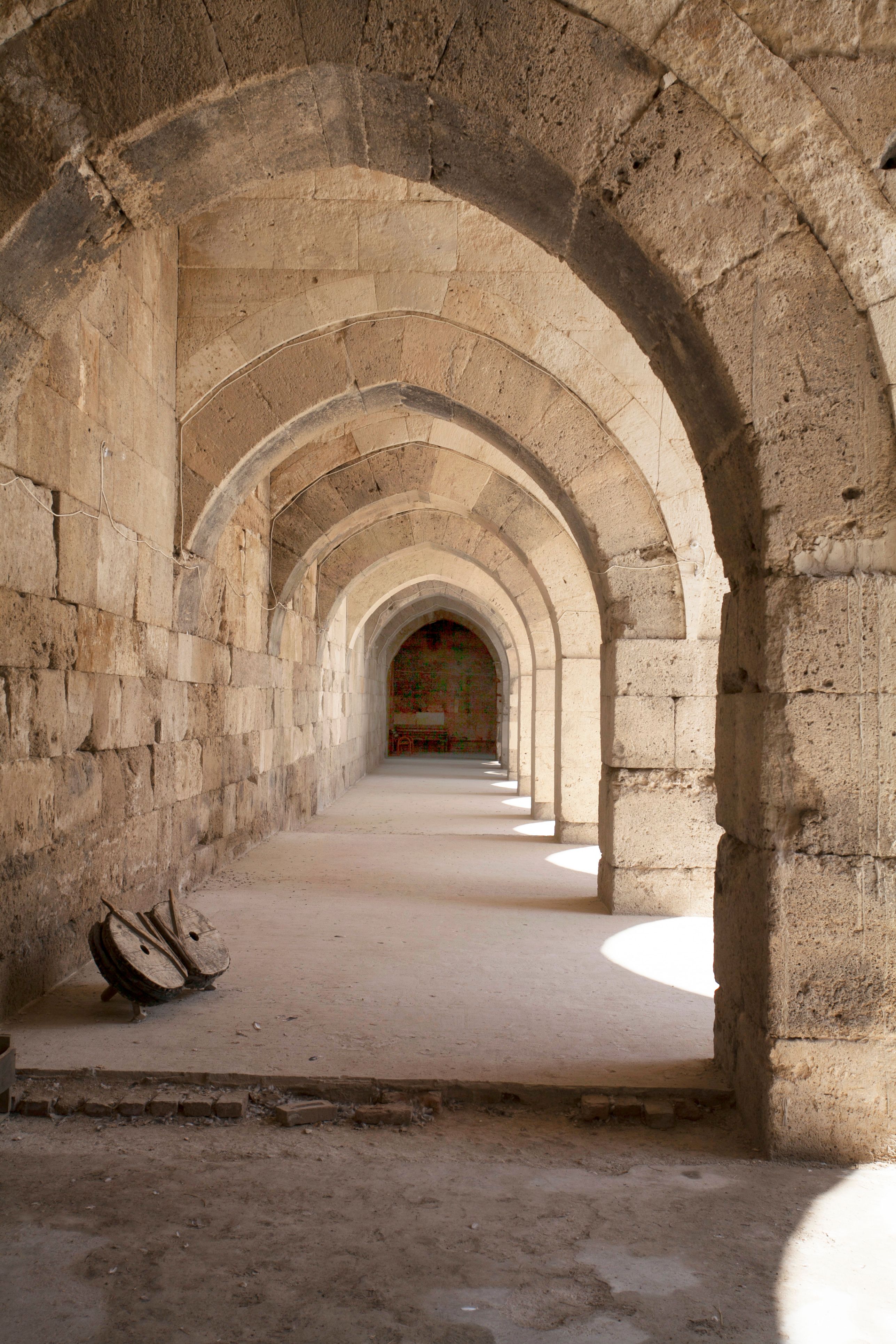 Historic Stone Corridor with Arched Ceilings · Free Stock Photo