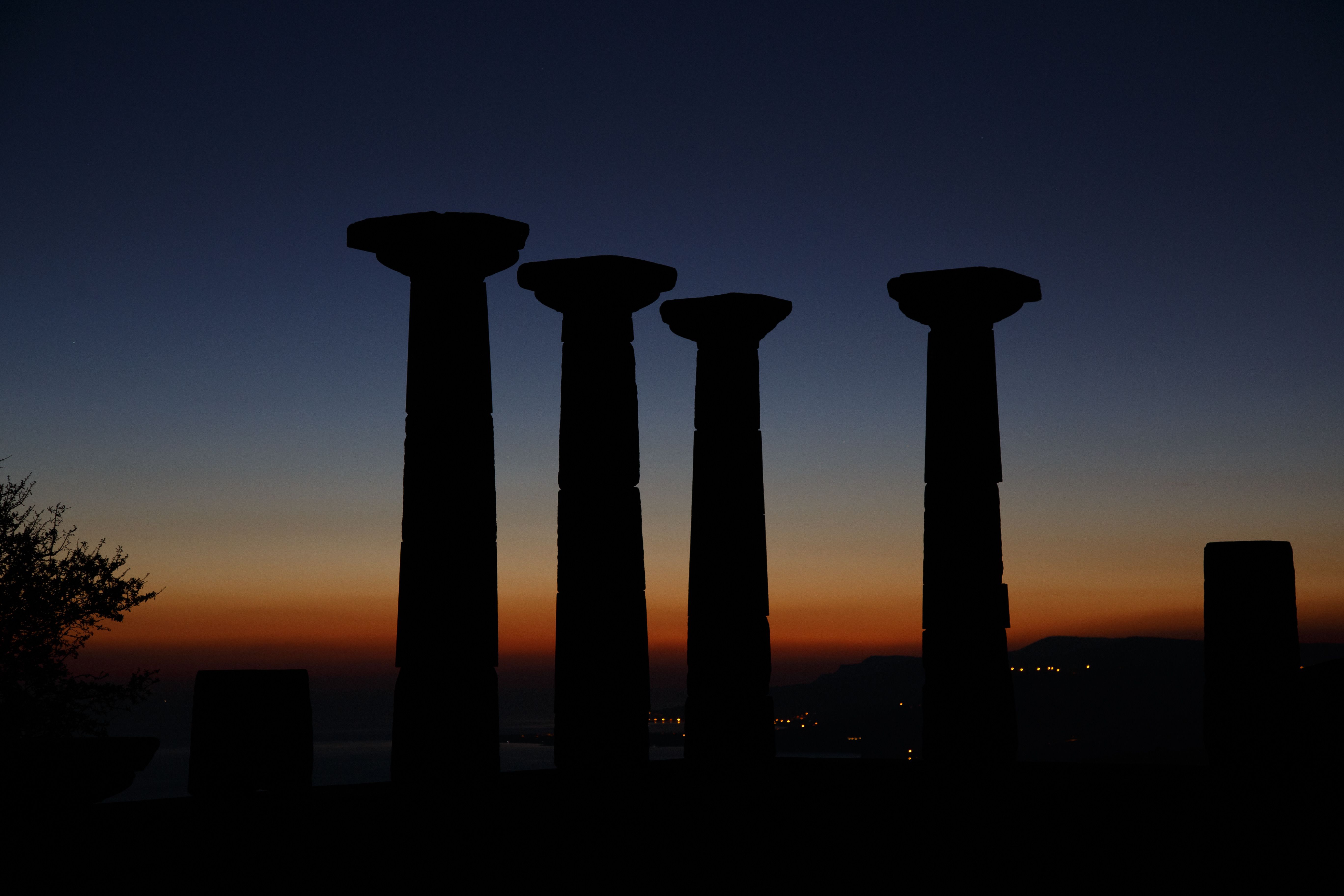 Ancient Greek Ruins Silhouetted at Sunset · Free Stock Photo