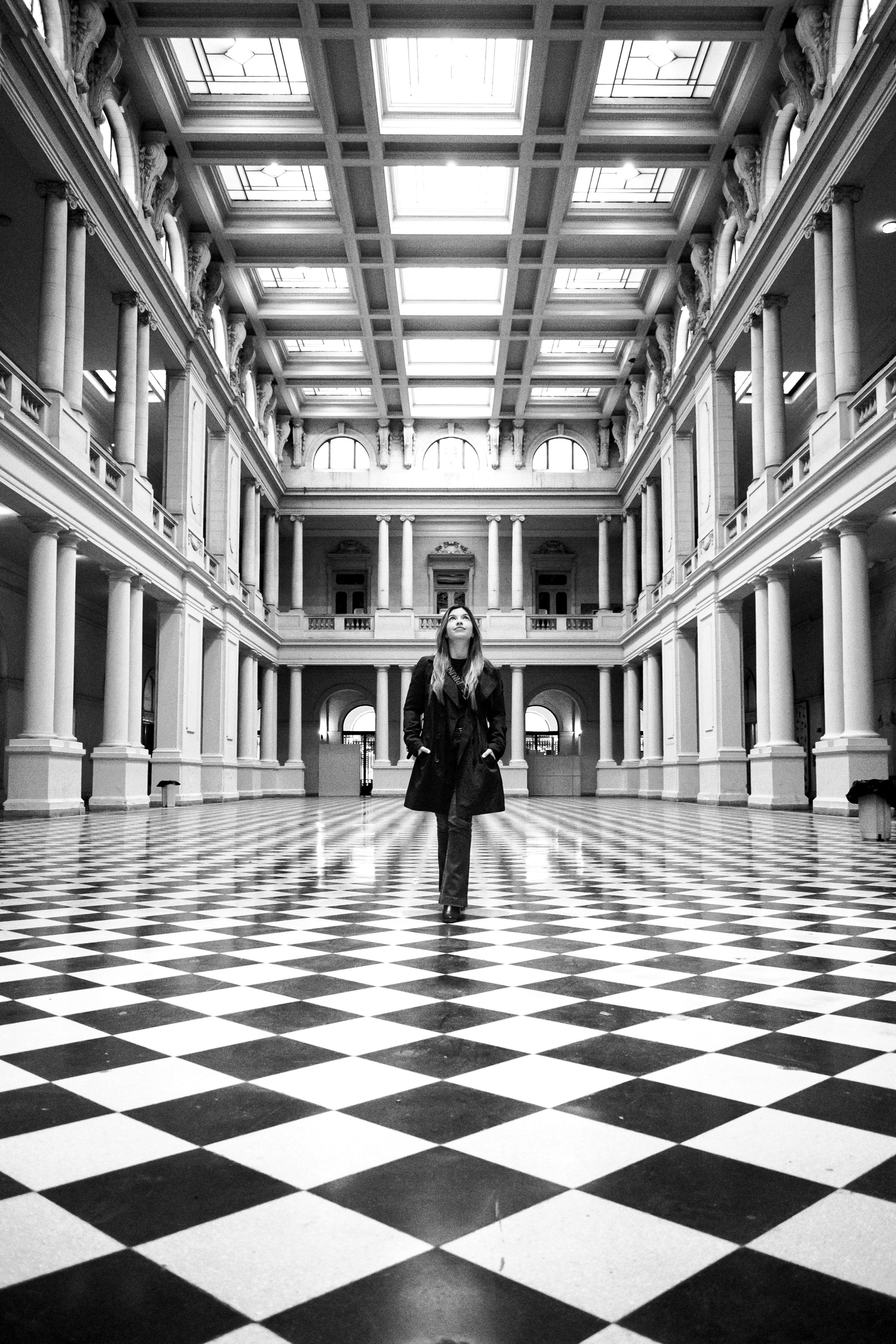 Elegant Woman in Monochrome Architectural Setting · Free Stock Photo