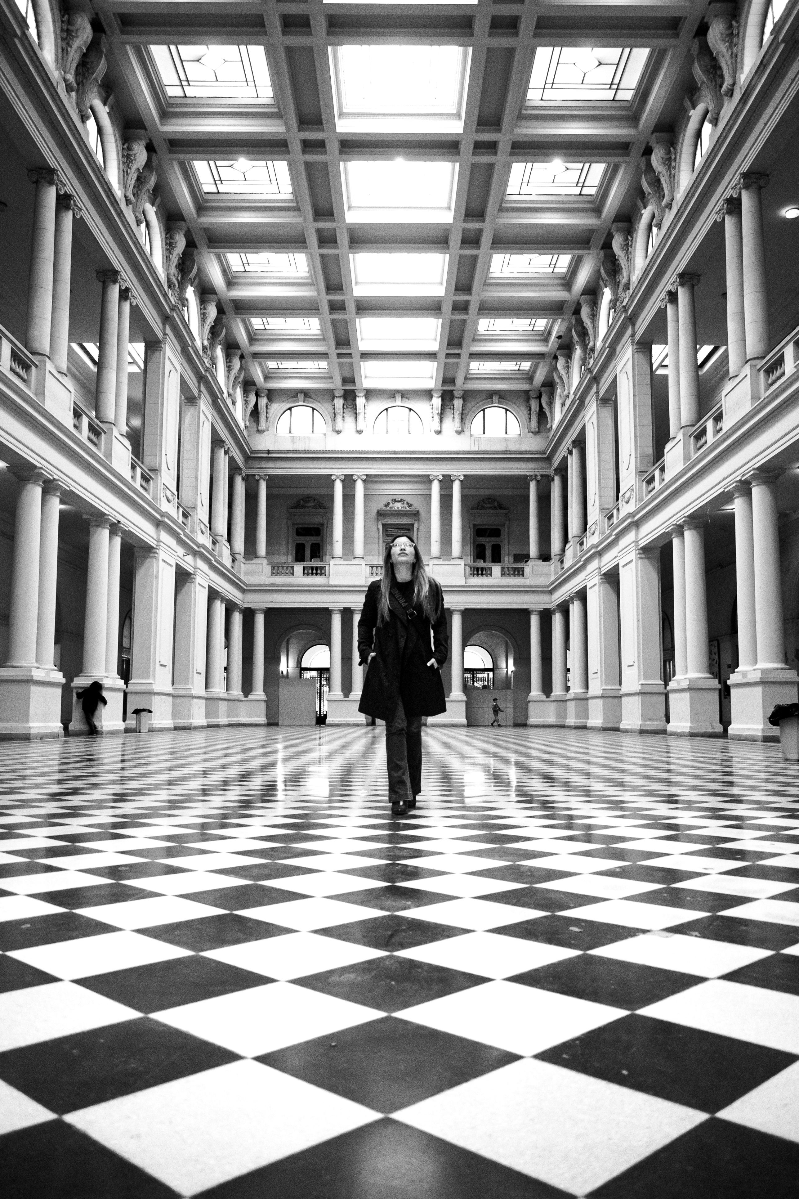 Elegant Monochrome Portrait in Grand Hall · Free Stock Photo