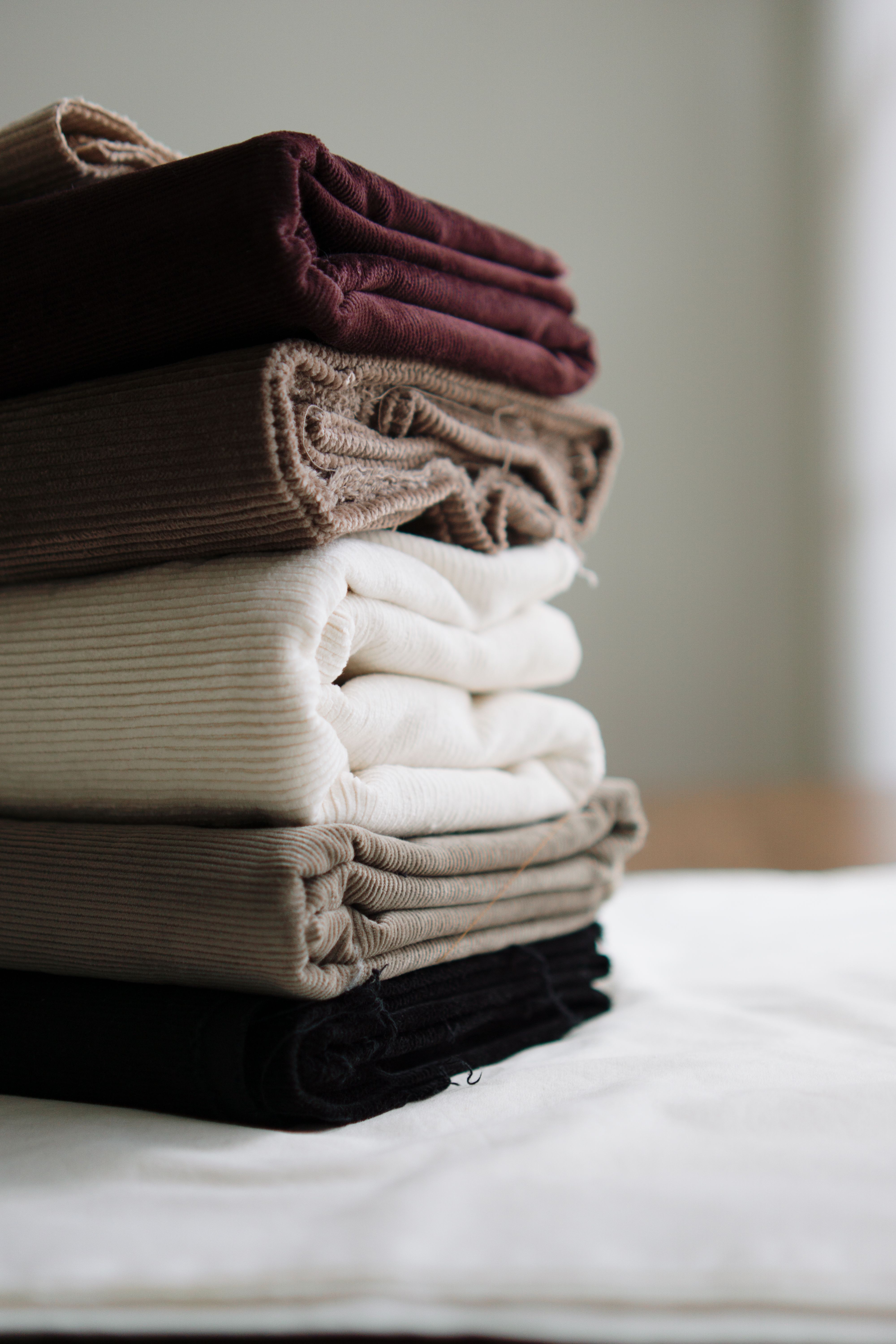 Stack of Folded Fabric with Various Textures · Free Stock Photo