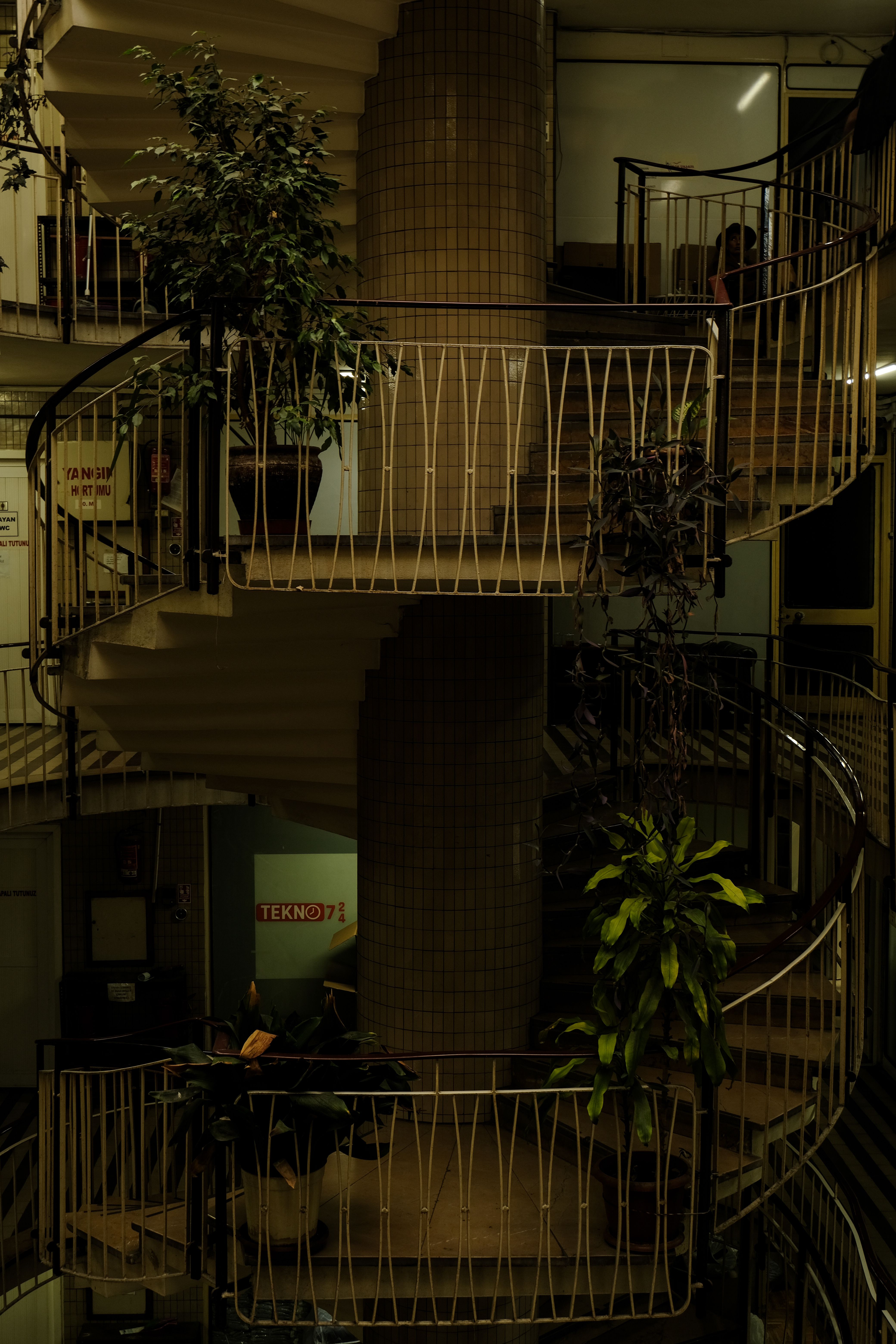 Spiral Staircase in Dimly Lit Building Interior · Free Stock Photo