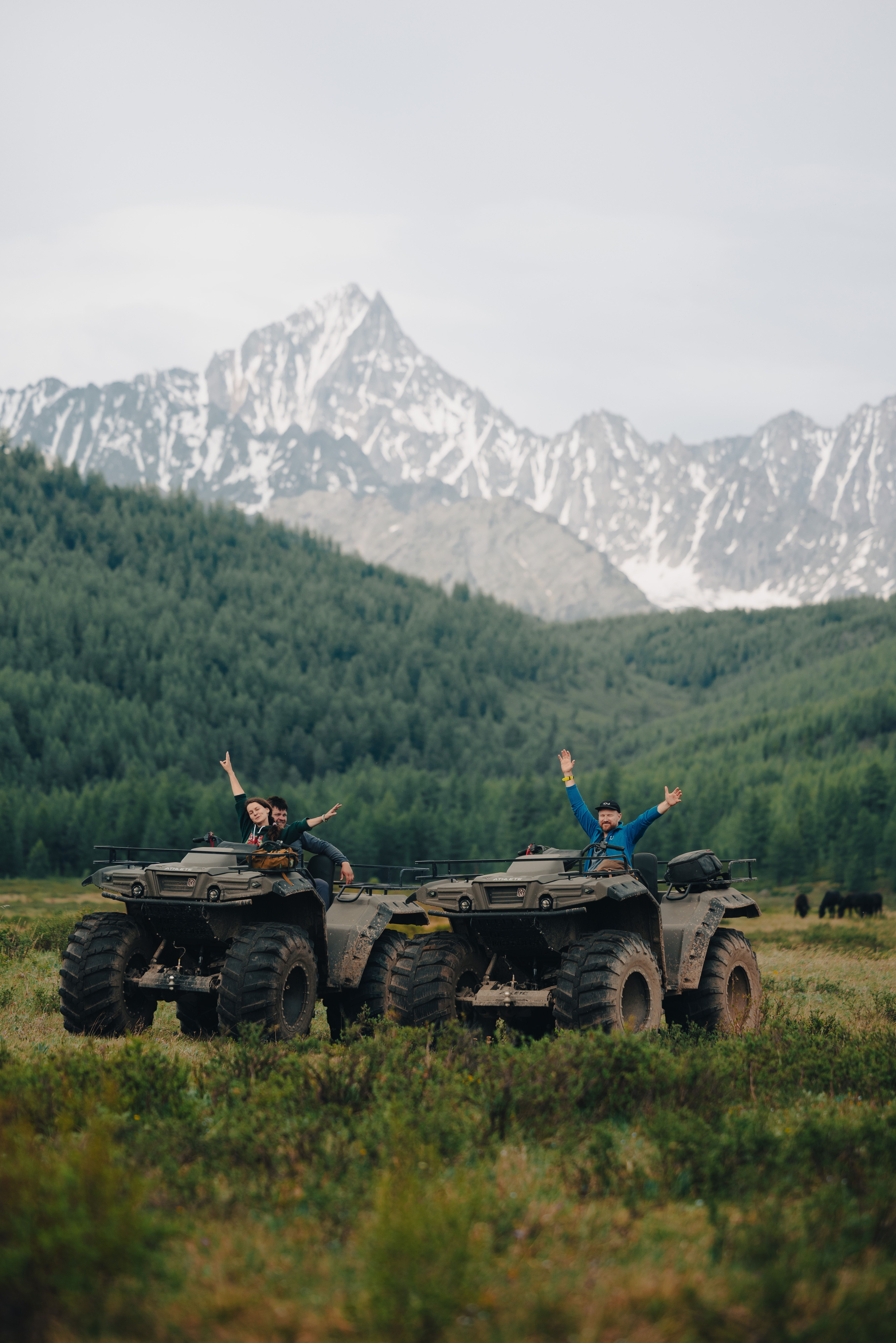 Adventure Enthusiasts on ATVs in Mountain Landscape · Free Stock Photo