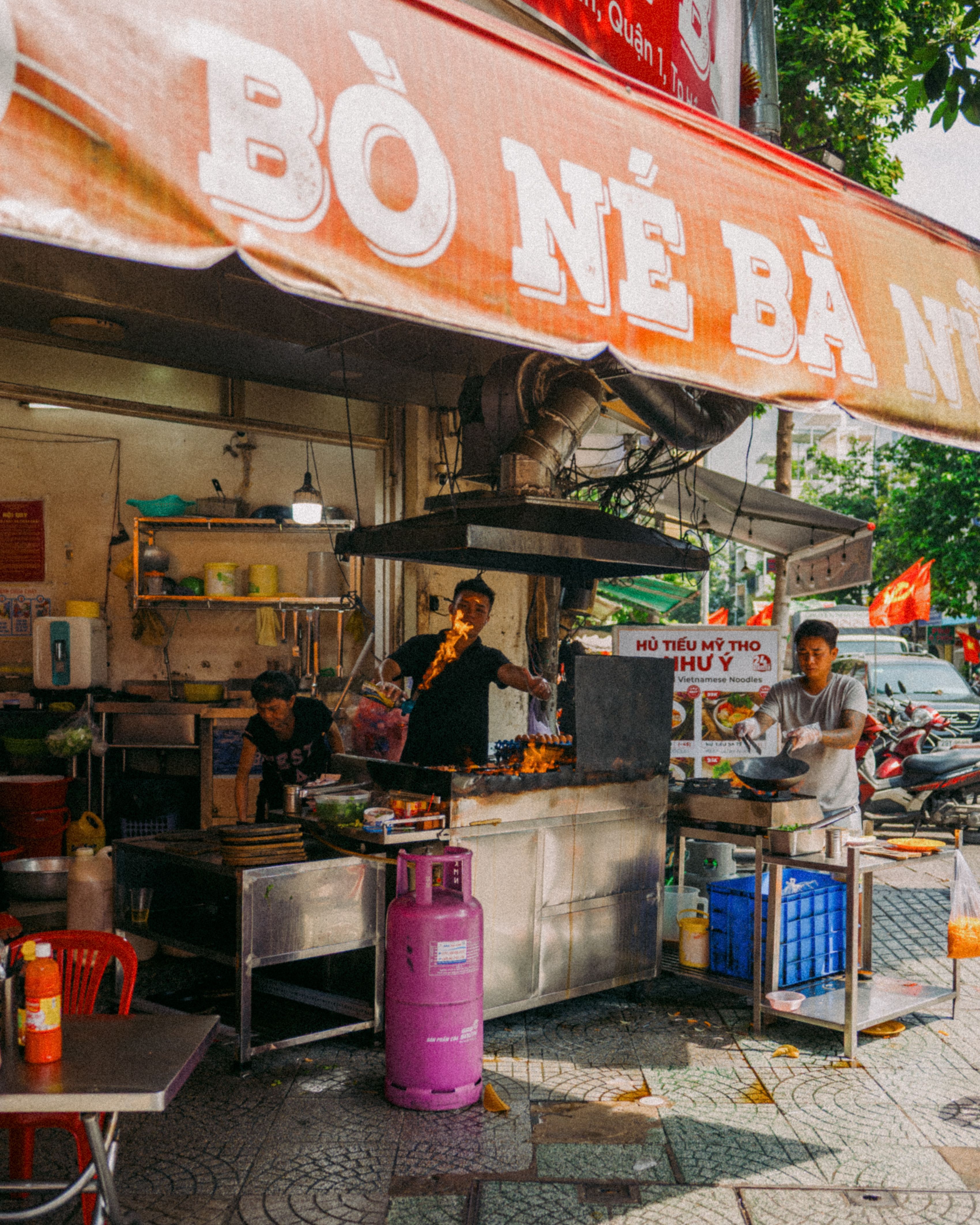 Outdoor Vietnamese Street Food Scene with Chefs · Free Stock Photo