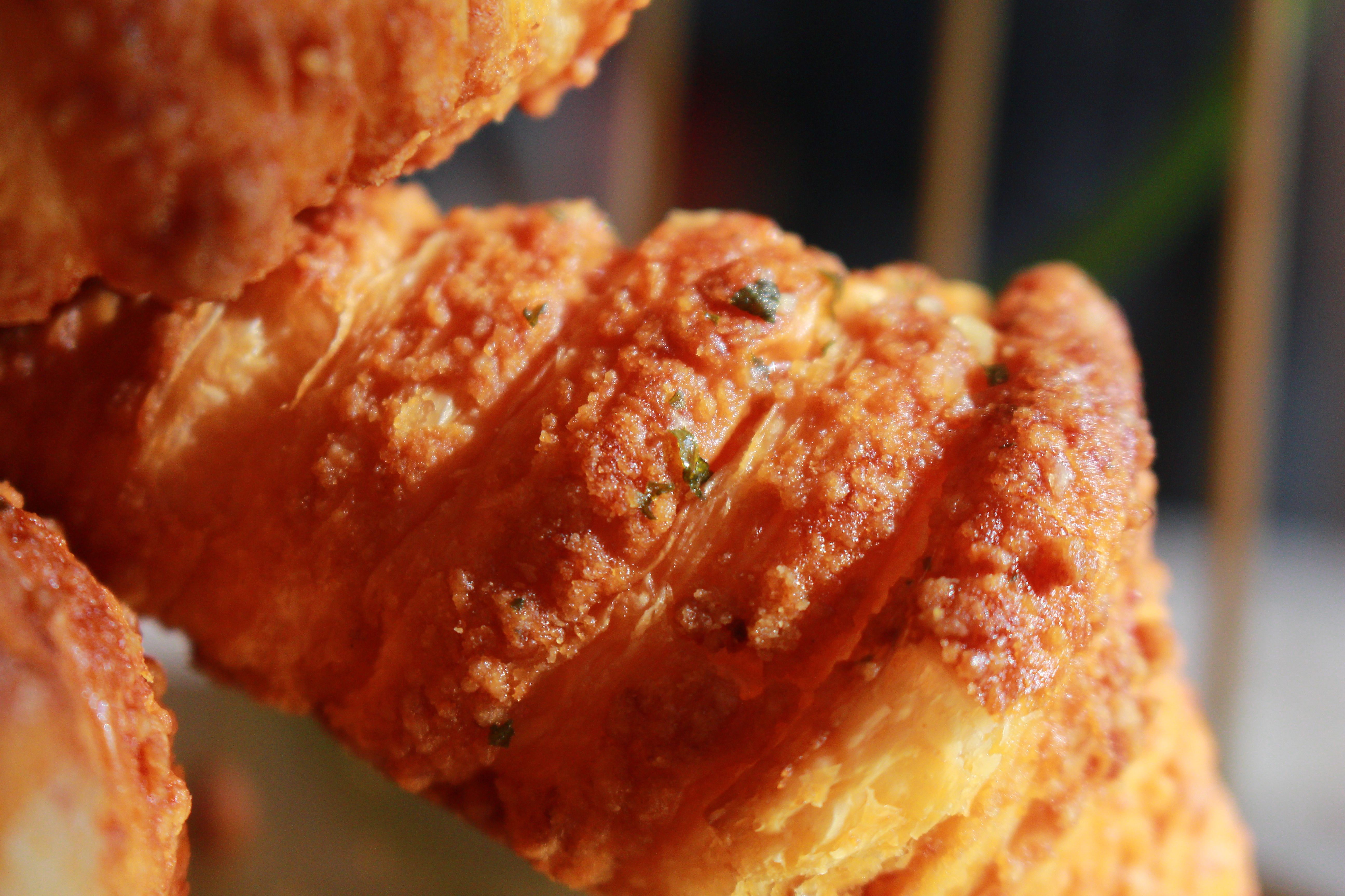 Close-Up of Golden Crispy Croissant Texture · Free Stock Photo