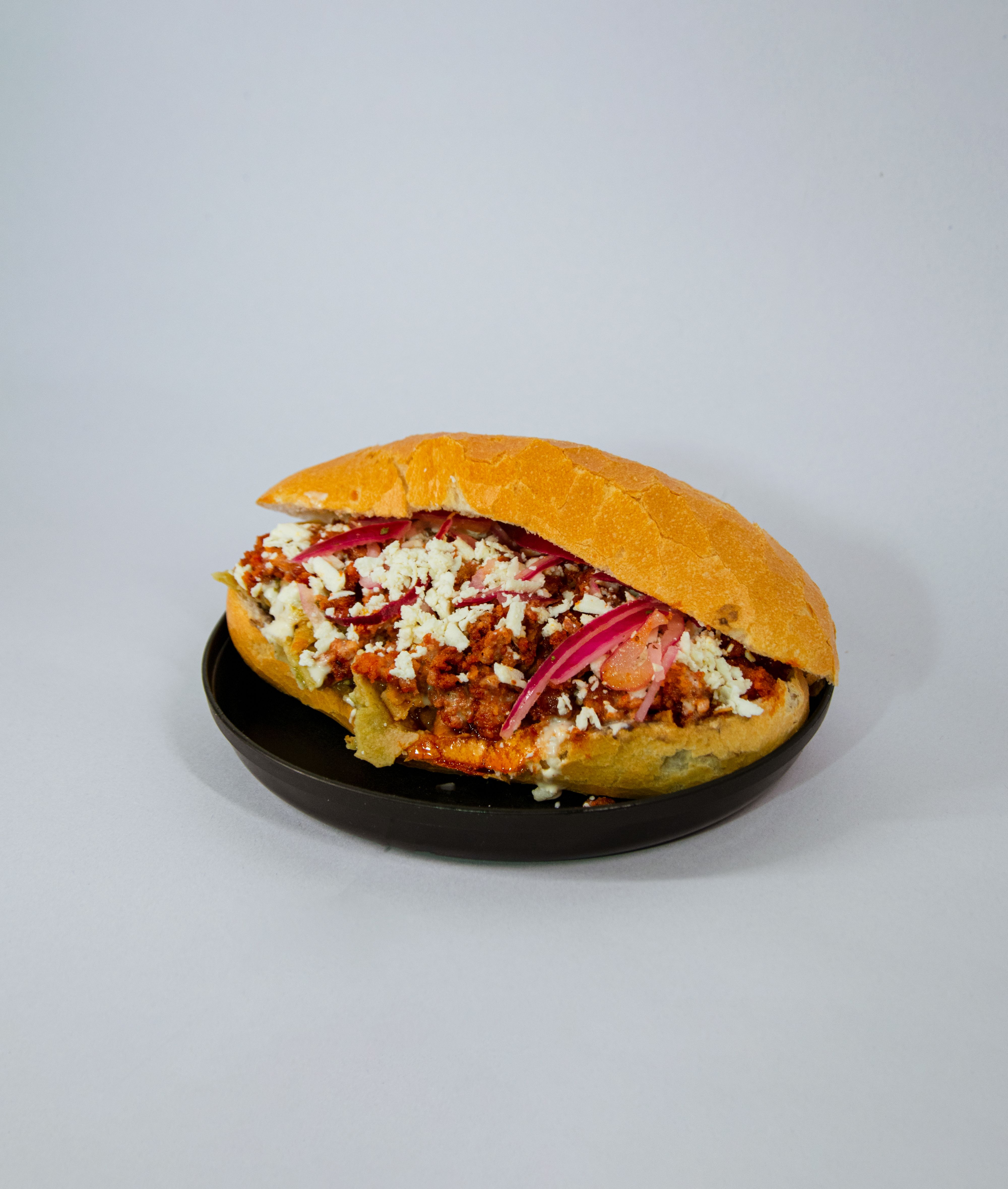 Delicious Traditional Mexican Torta on Plate · Free Stock Photo