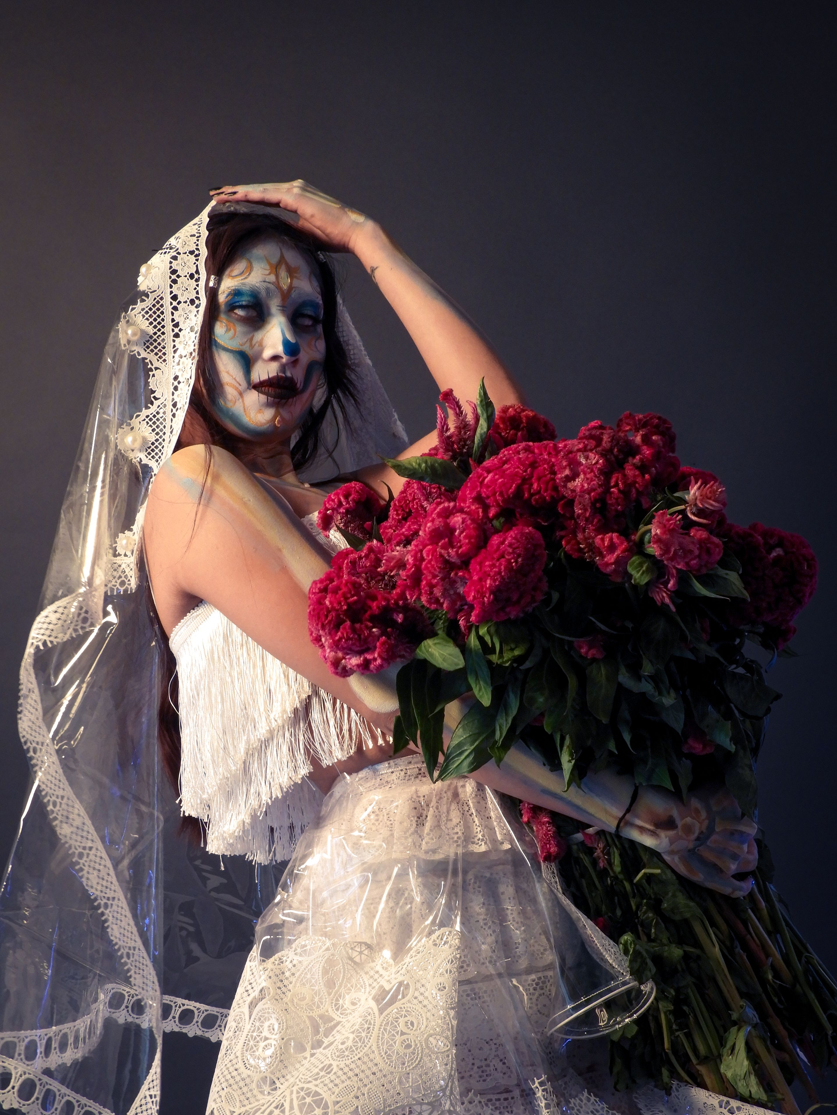 Traditional Day of the Dead Bride with Floral Bouquet · Free Stock Photo