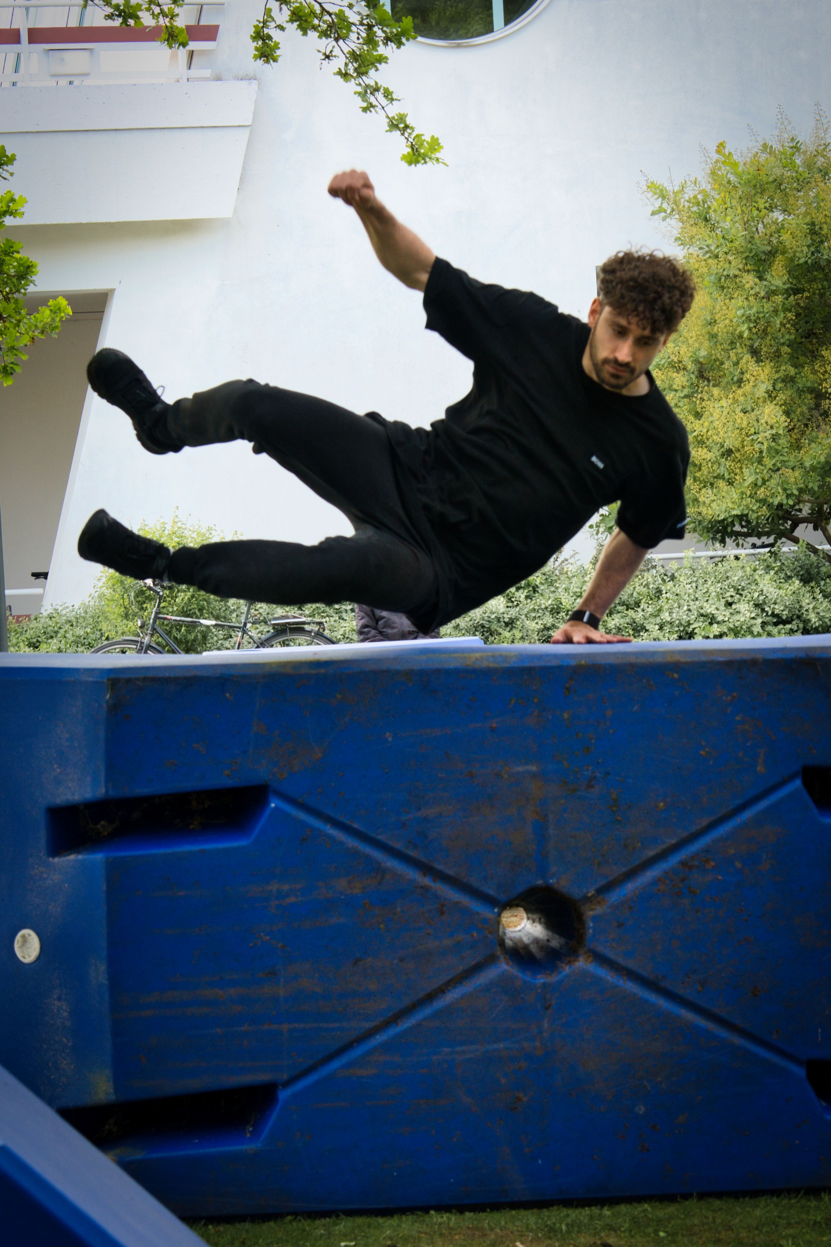 Dynamic Parkour Athlete in Motion at Berlin Park · Free Stock Photo