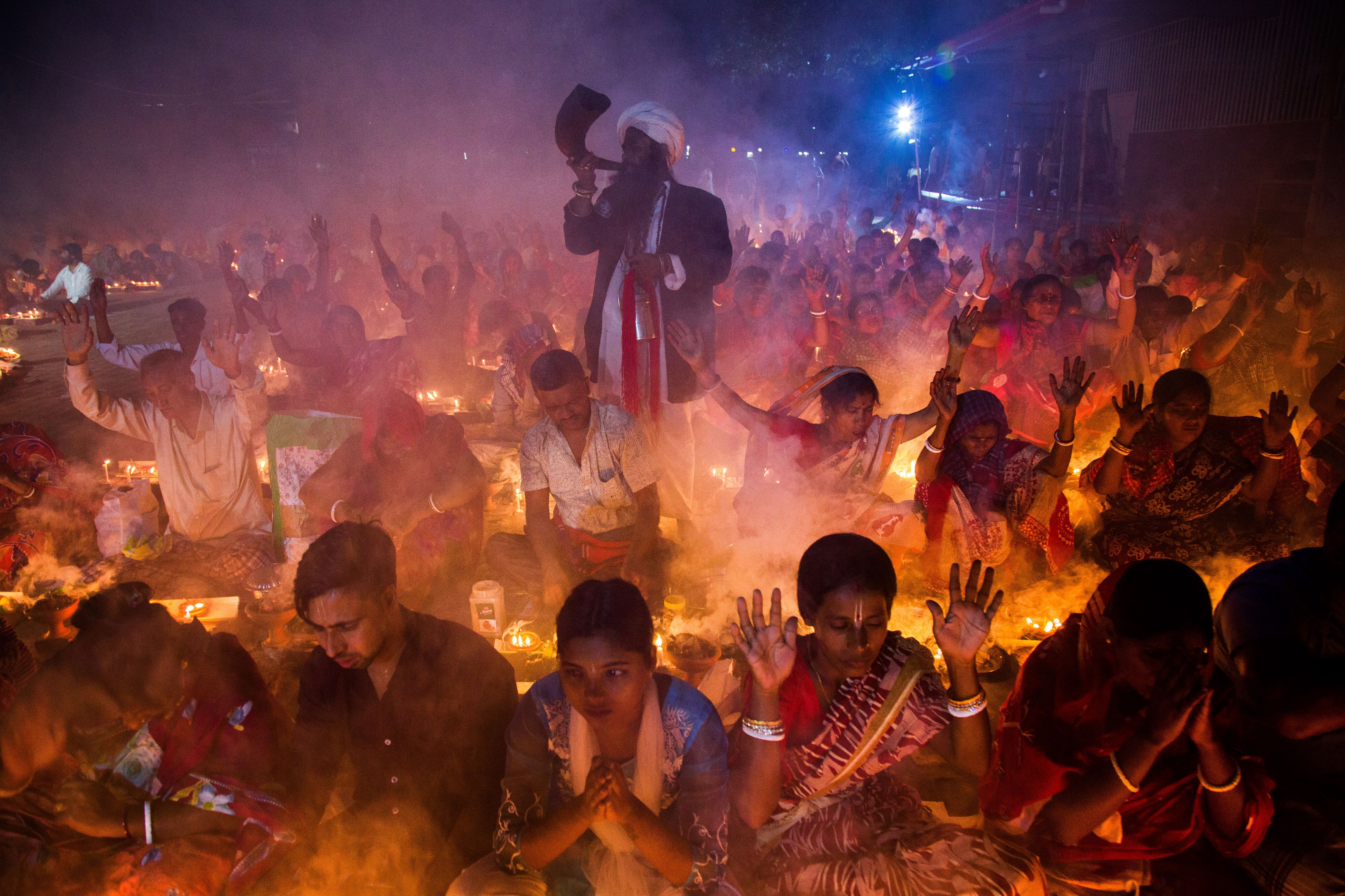 Vibrant Night Ritual with Devotees in Prayer · Free Stock Photo