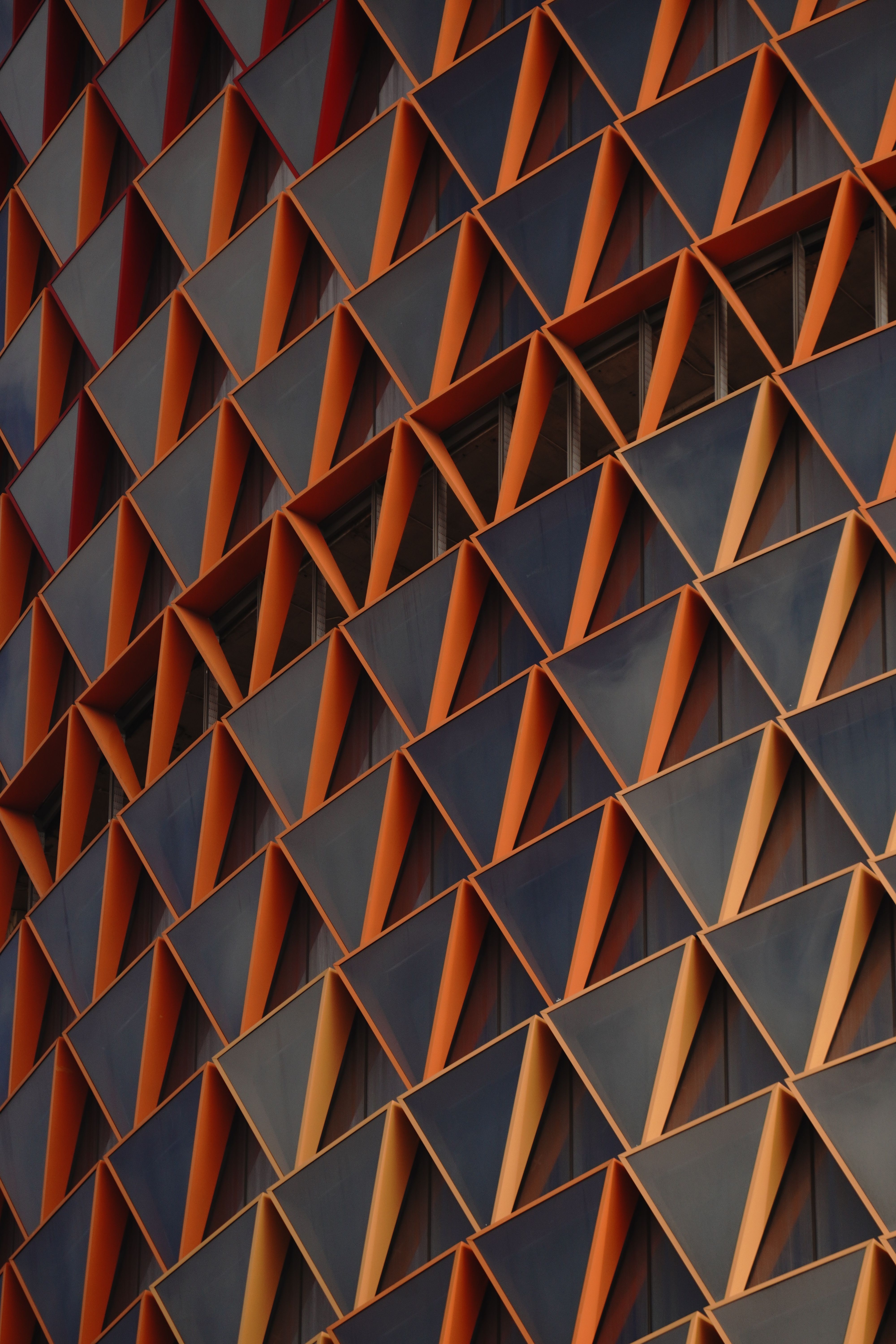 Geometric Architectural Facade with Orange Panels · Free Stock Photo