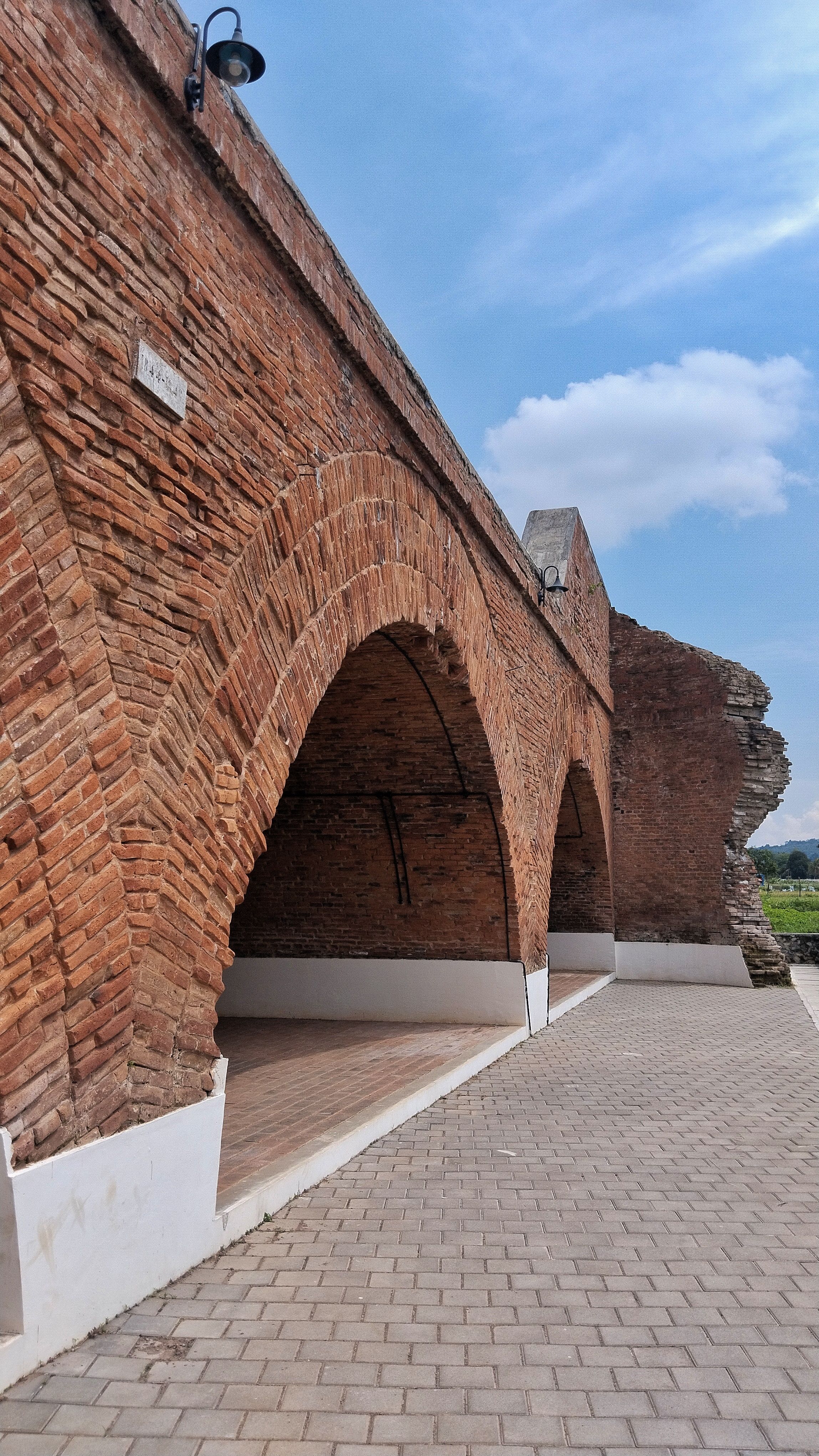 Historic Brick Arches Under Blue Sky · Free Stock Photo