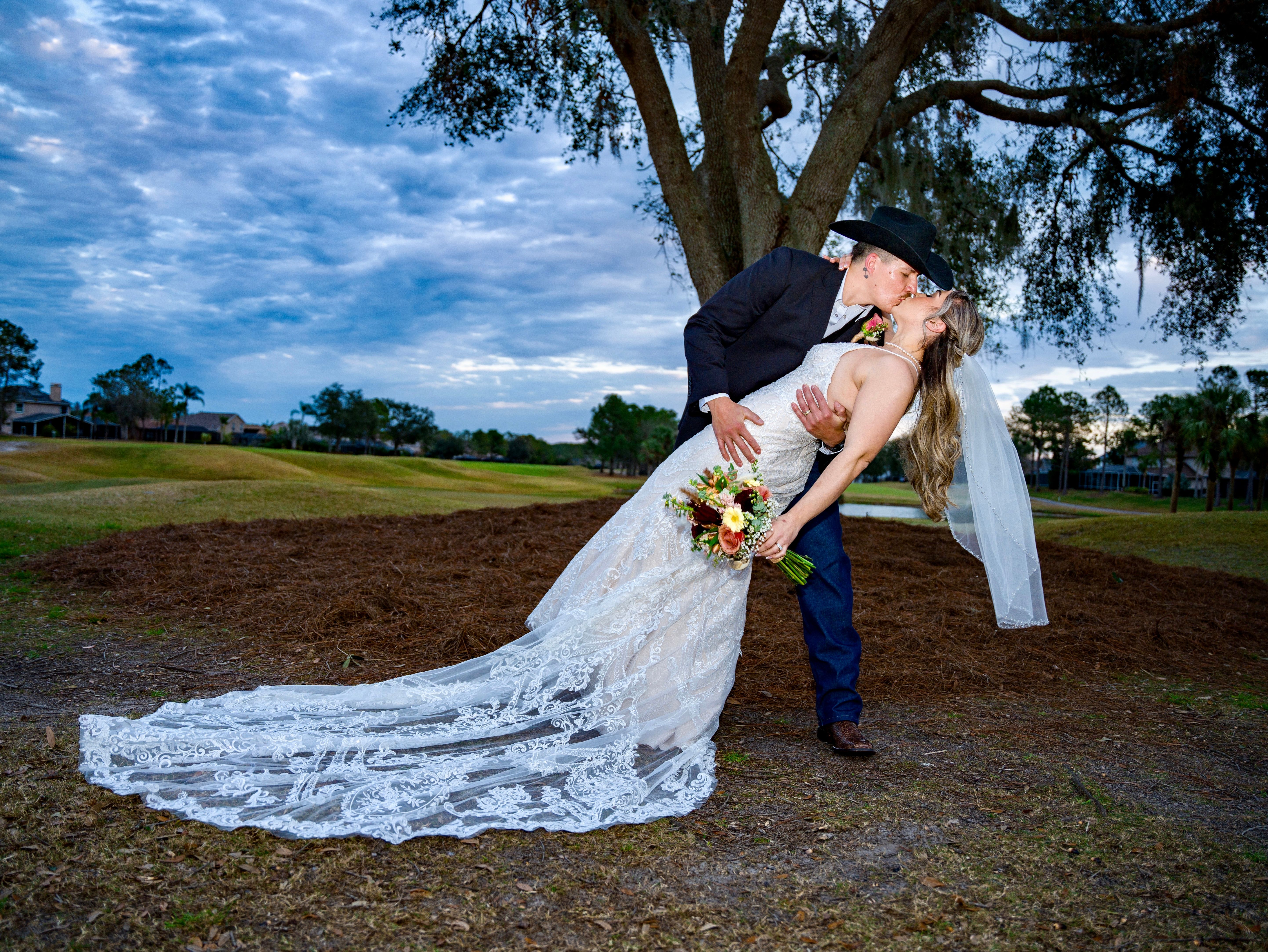 Romantic Outdoor Wedding Kiss Under Tree · Free Stock Photo
