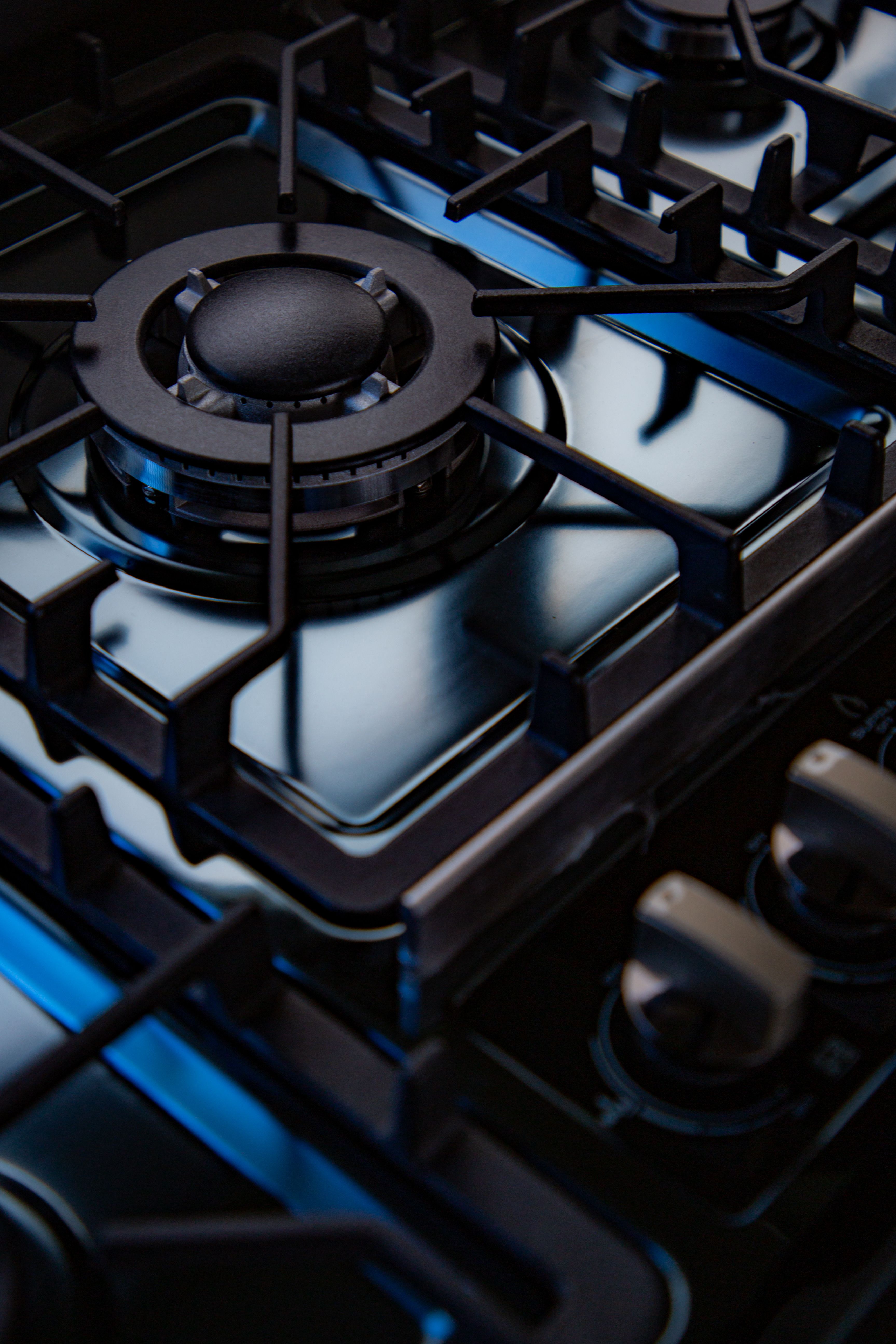 Close-up of Modern Gas Stove Burner with Blue Tint · Free Stock Photo
