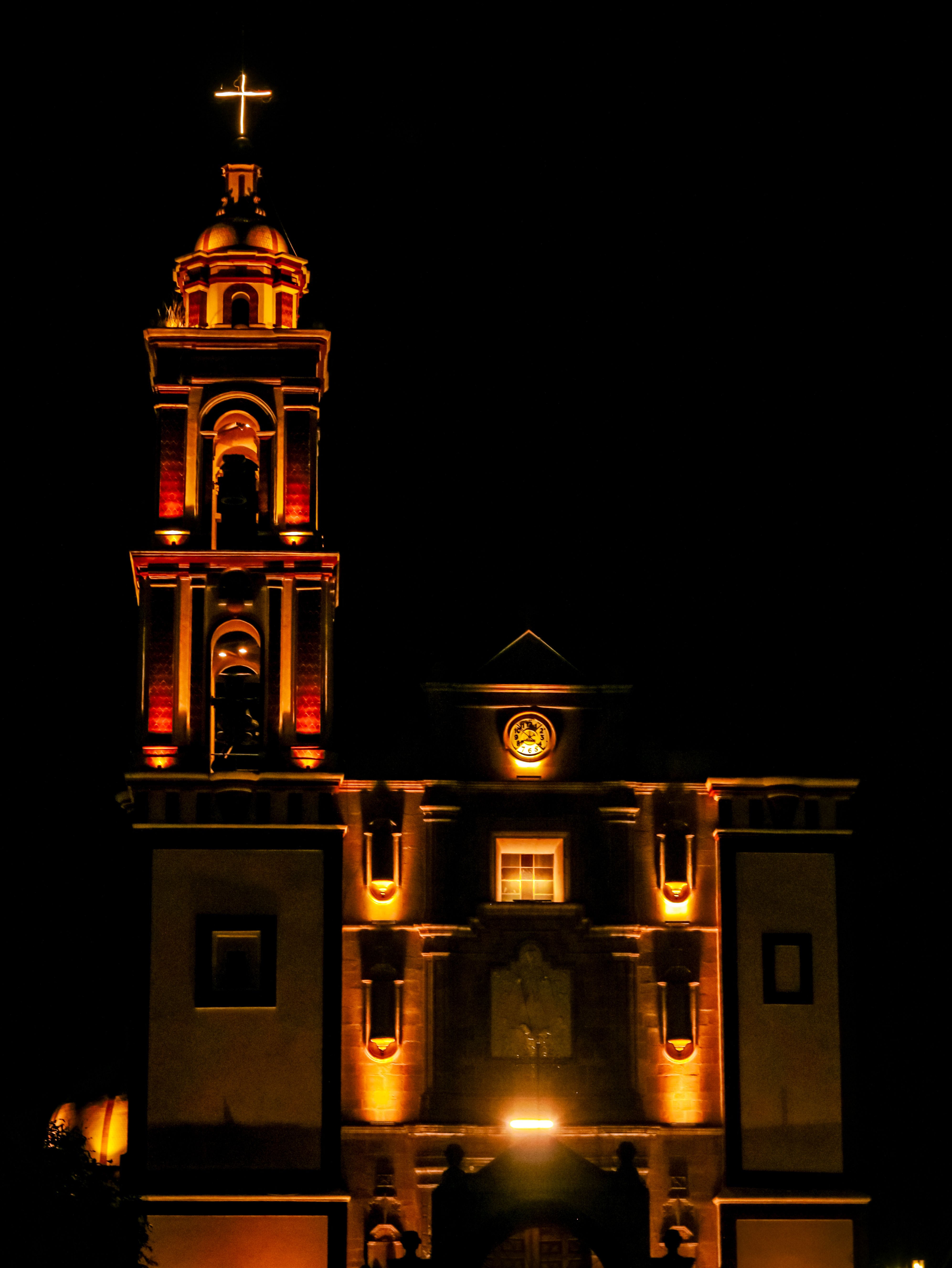 Illuminated Church at Night with Tower Cross · Free Stock Photo