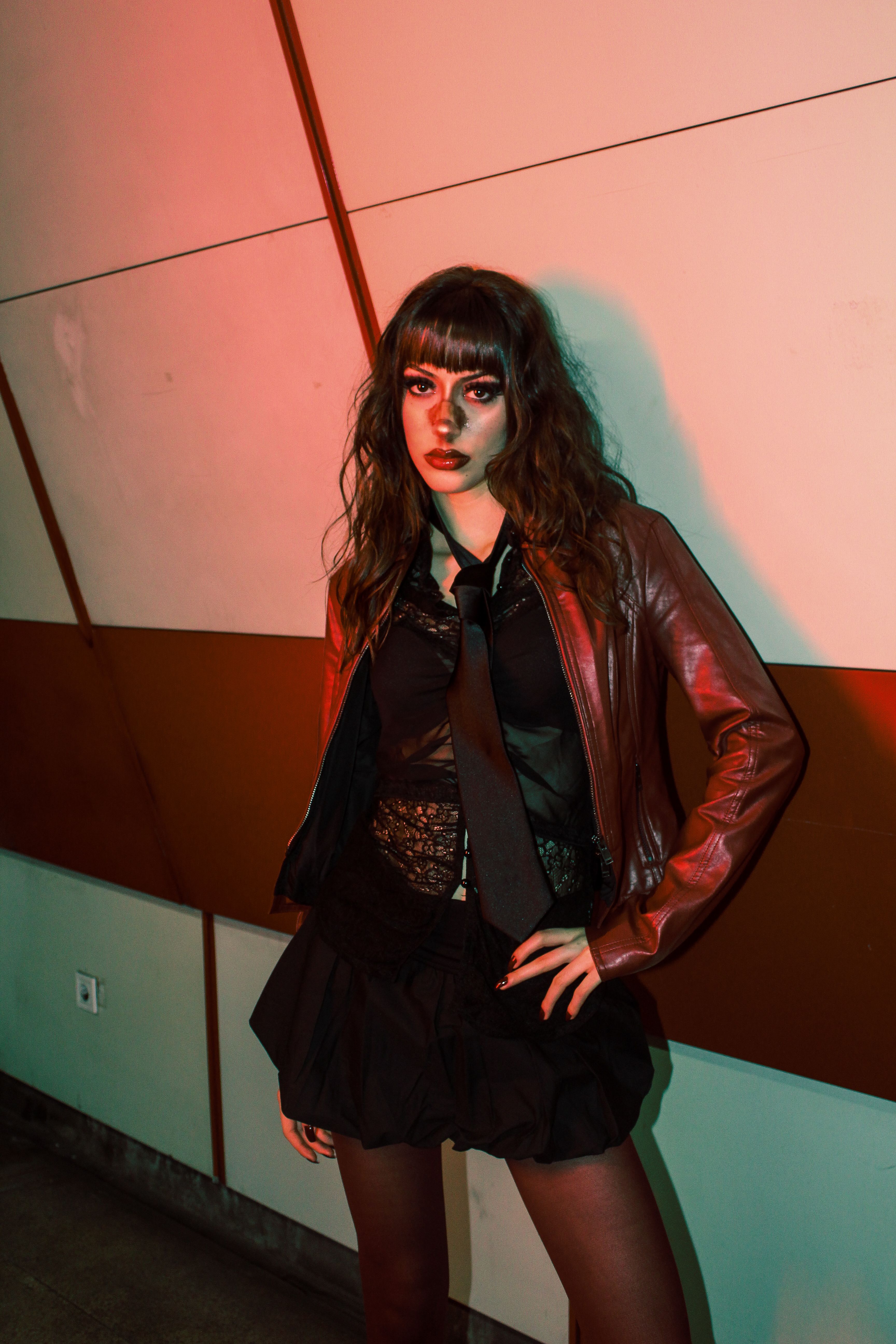 Stylish Woman in Urban Setting with Dramatic Lighting · Free Stock Photo