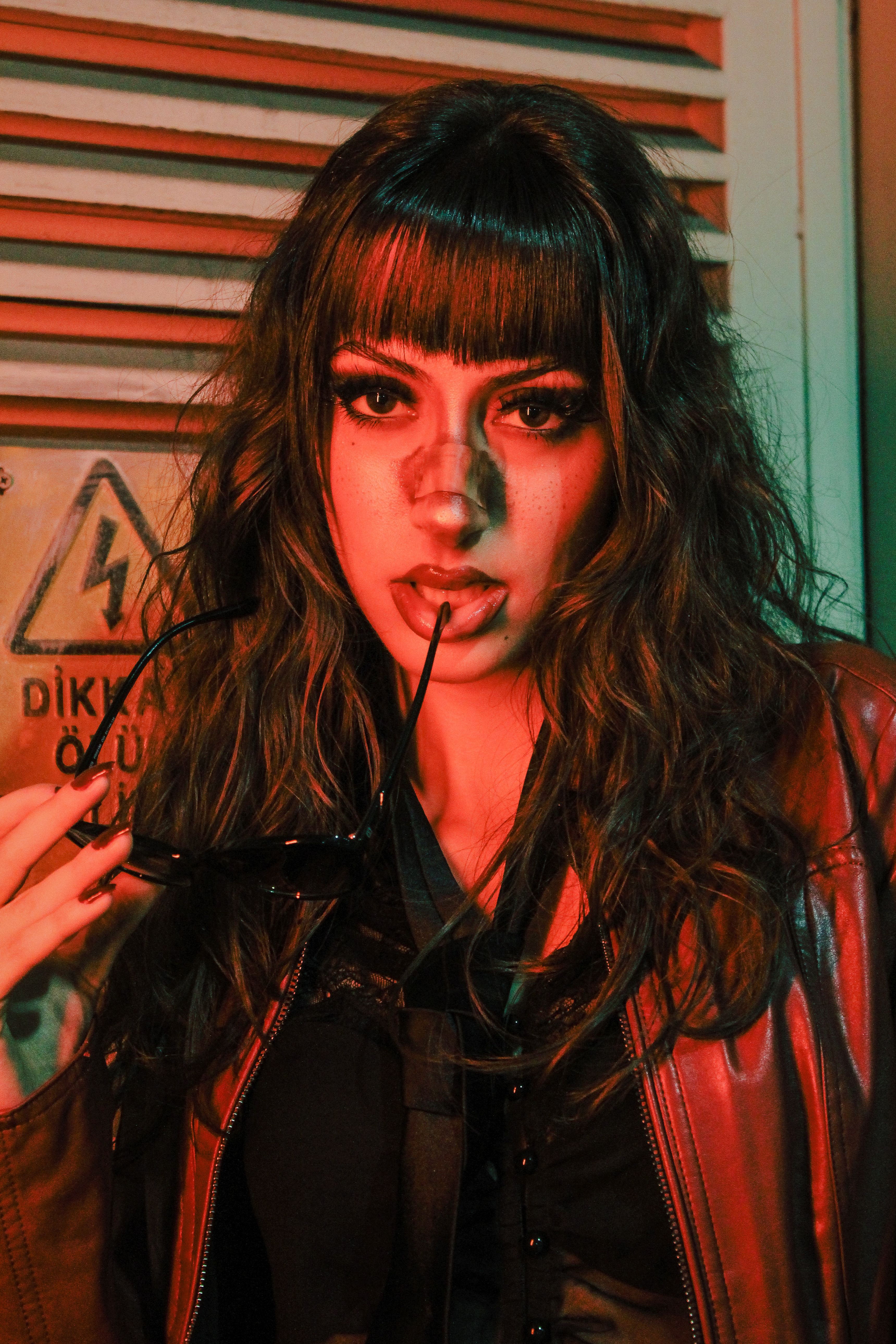 Stylish Woman in Leather Jacket with Neon Lighting · Free Stock Photo