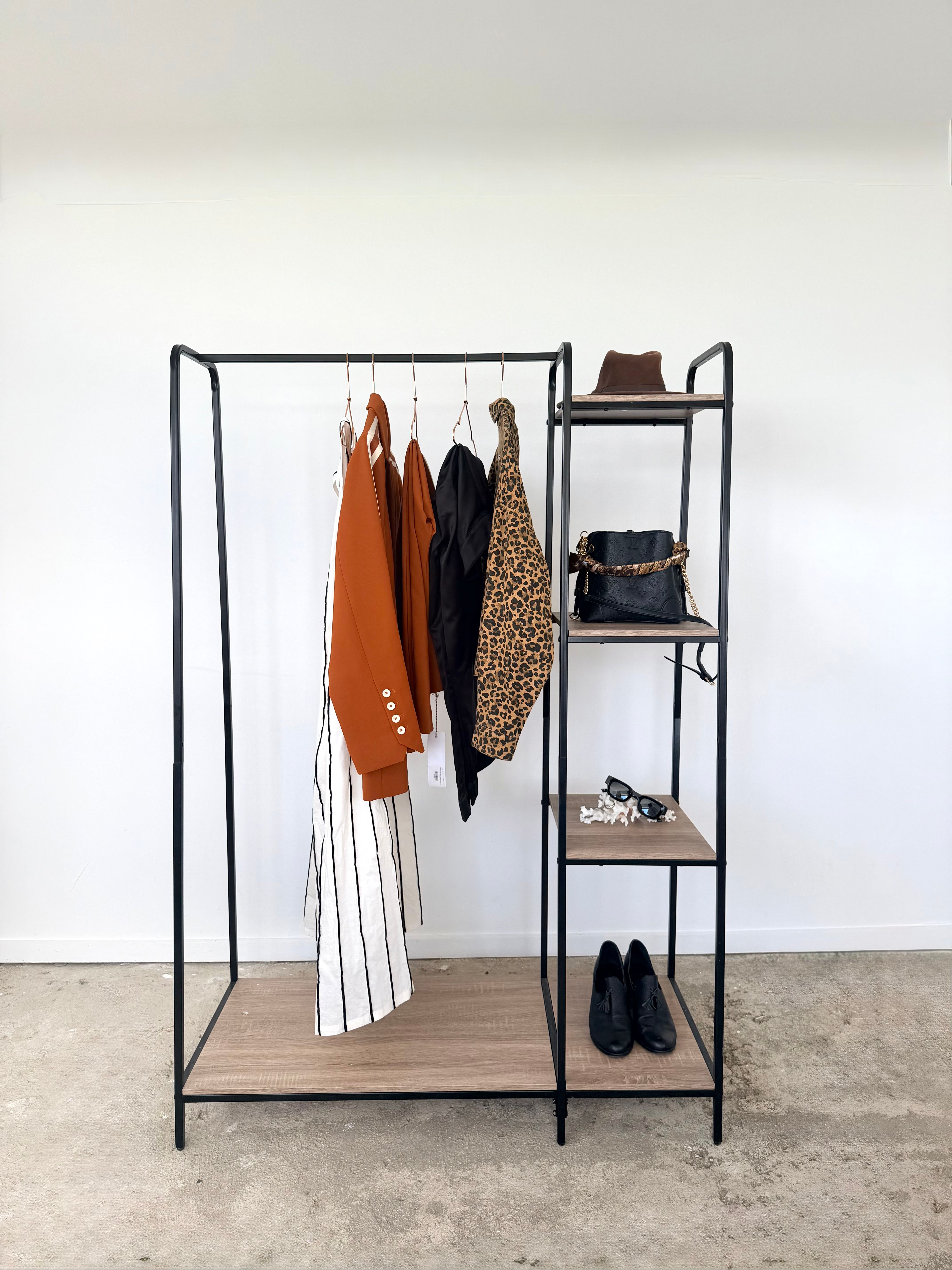 Minimalist Wardrobe with Stylish Clothing Display · Free Stock Photo