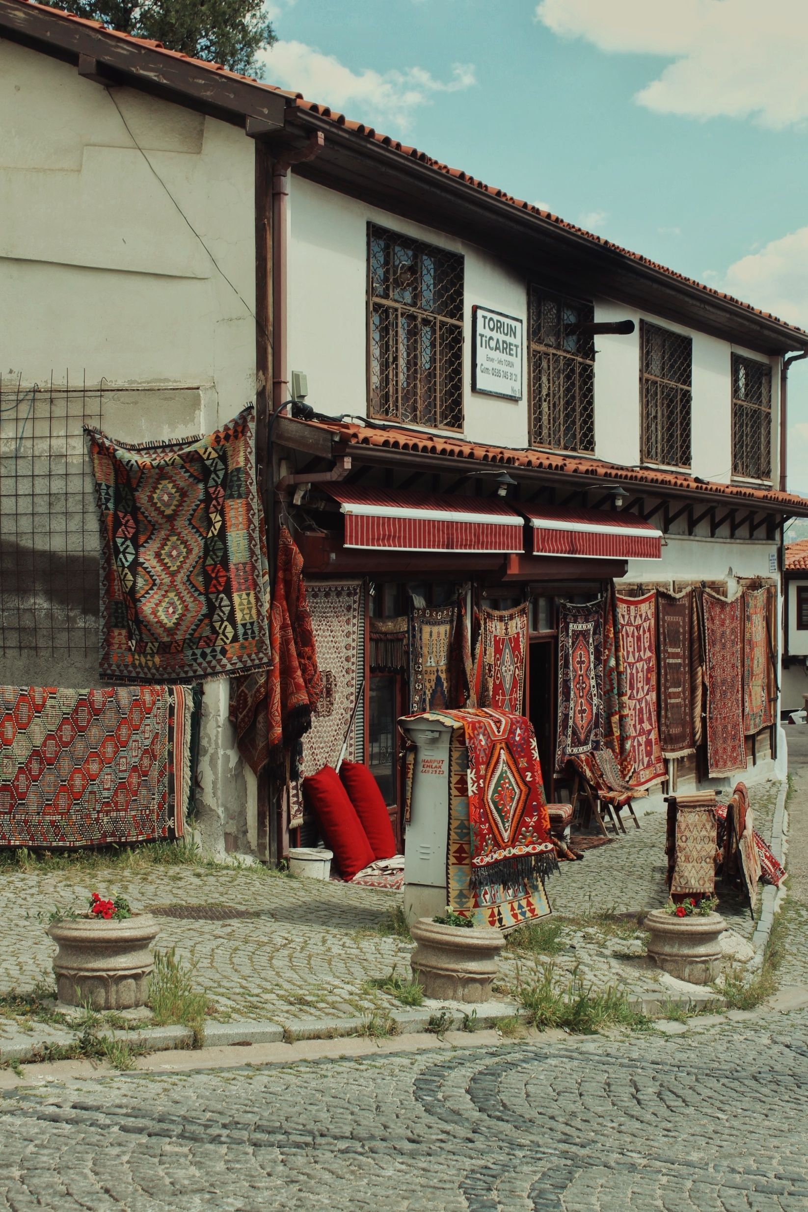 Colorful Turkish Carpets Displayed Outdoors in Ankara · Free Stock Photo