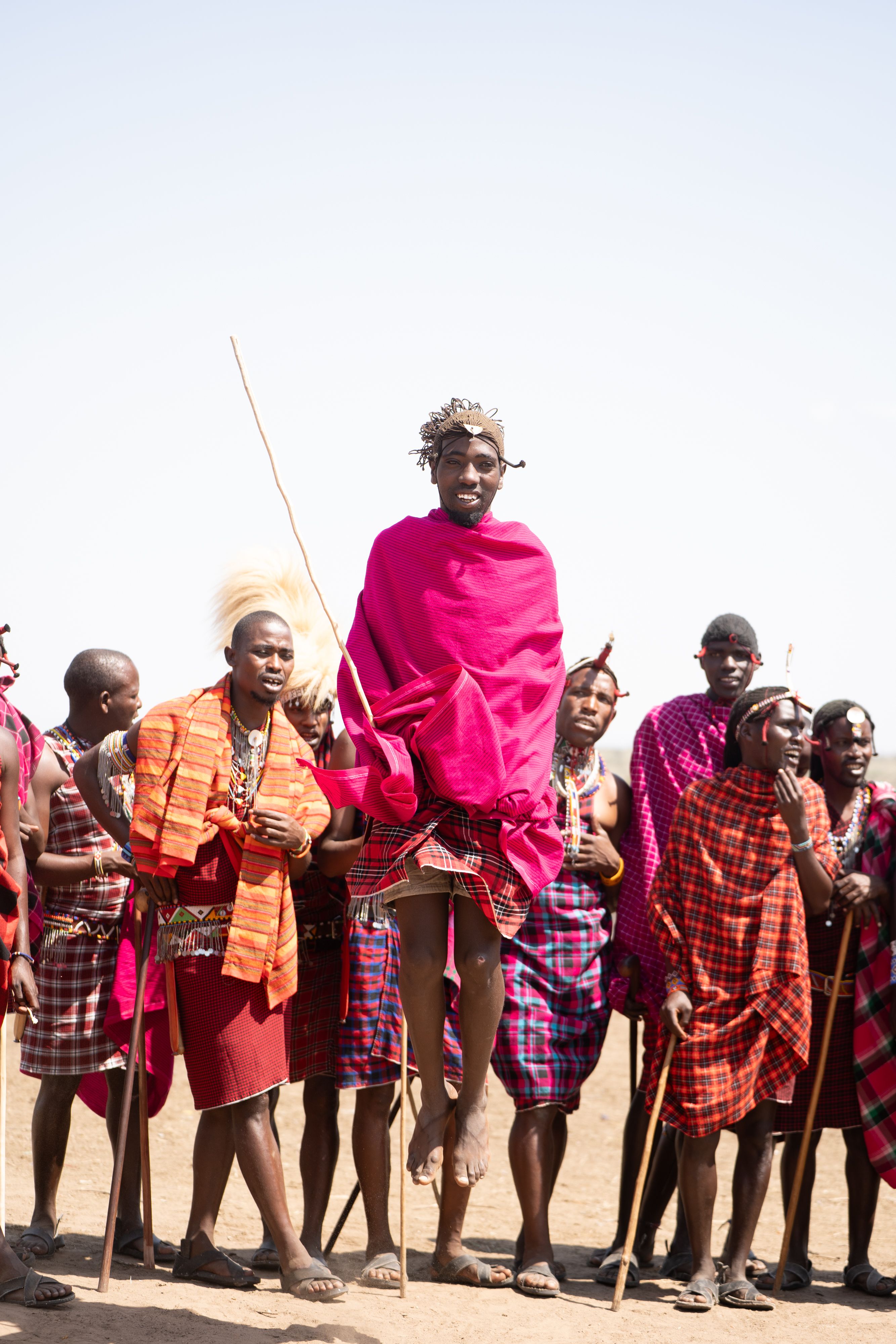 Photo of Group of Men Wearing Assorted Scarves Holding Sticks · Free ...