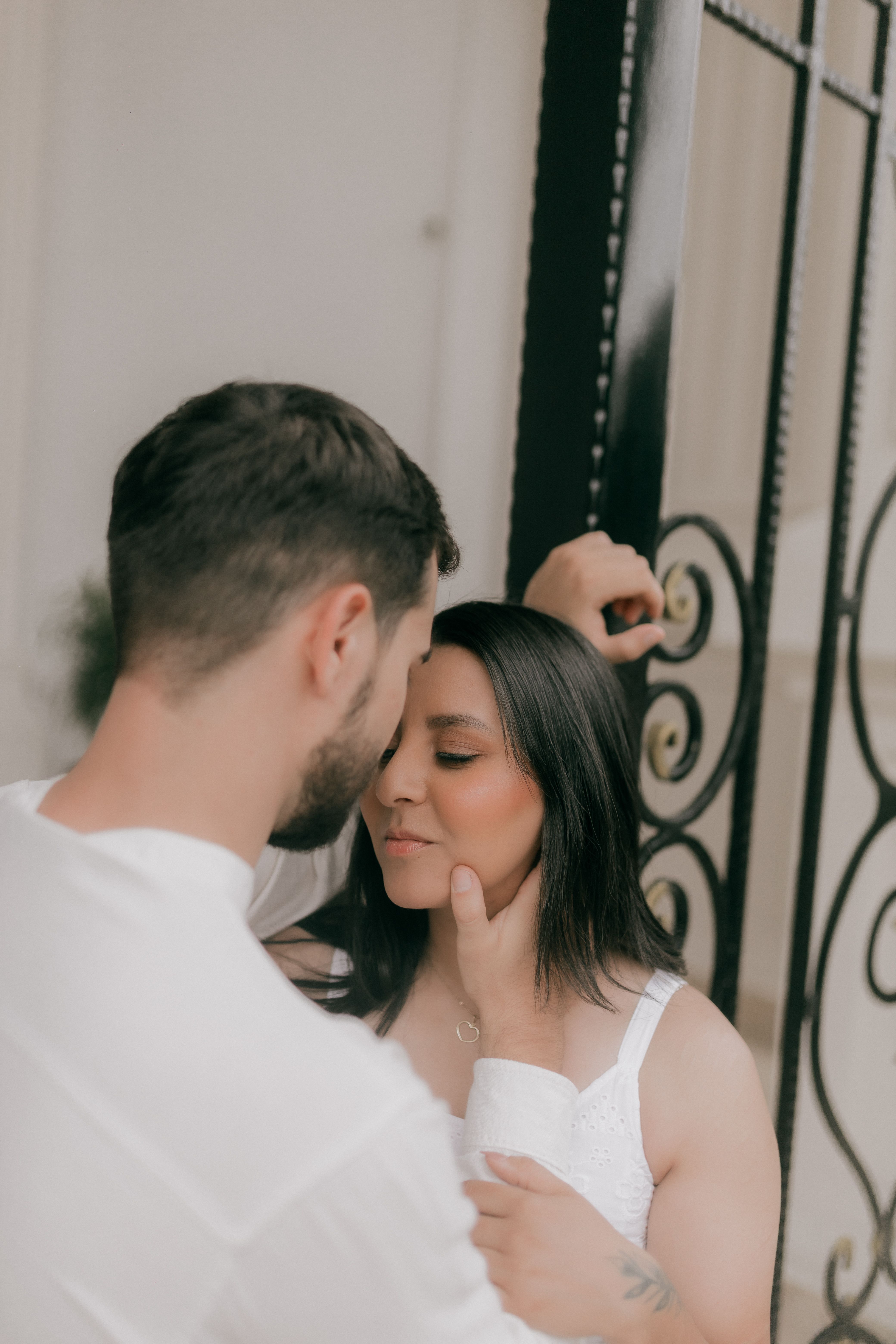 A Man Kissing the Woman's Shoulder · Free Stock Photo