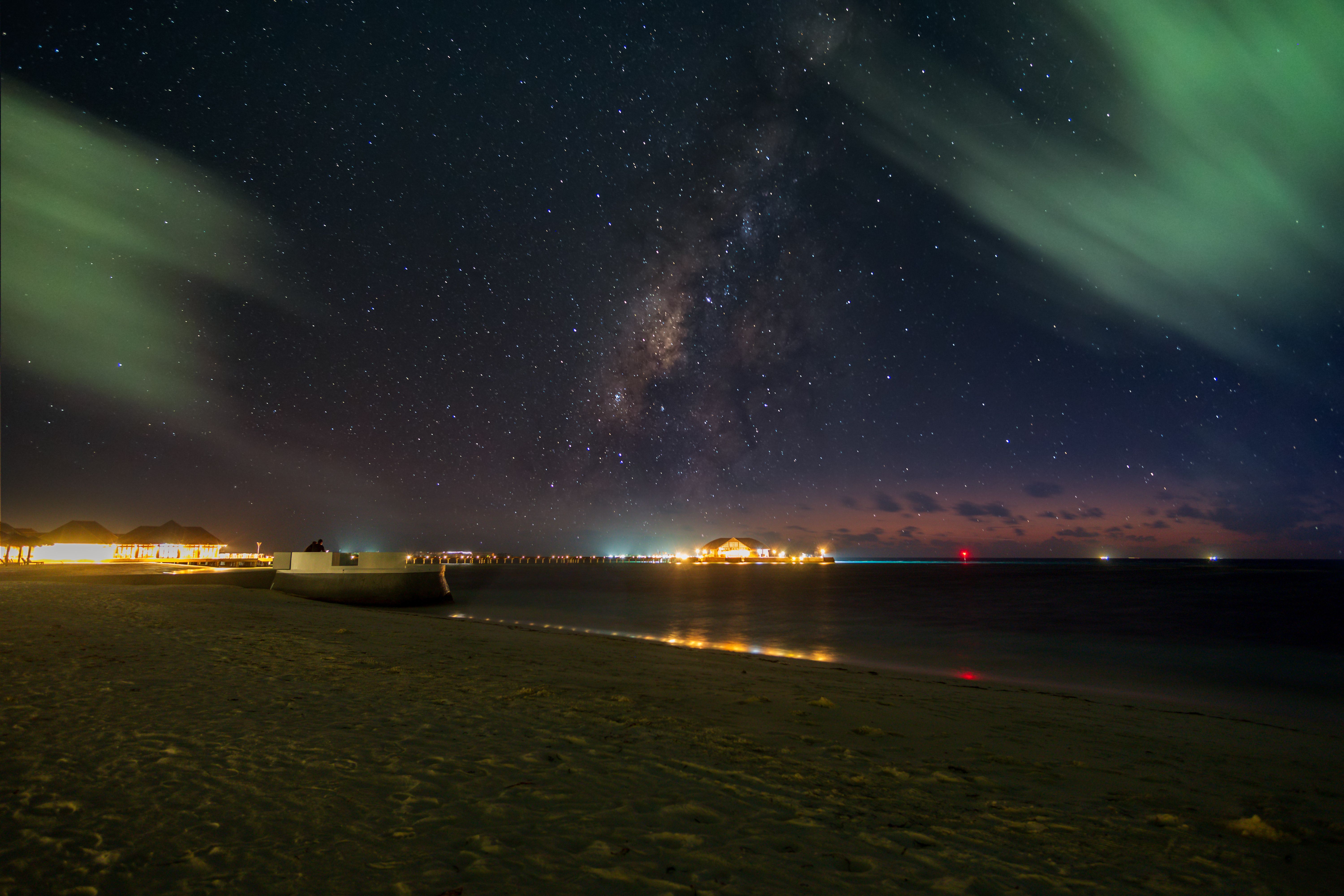 Spectacular Starry Night Over Tranquil Beach · Free Stock Photo