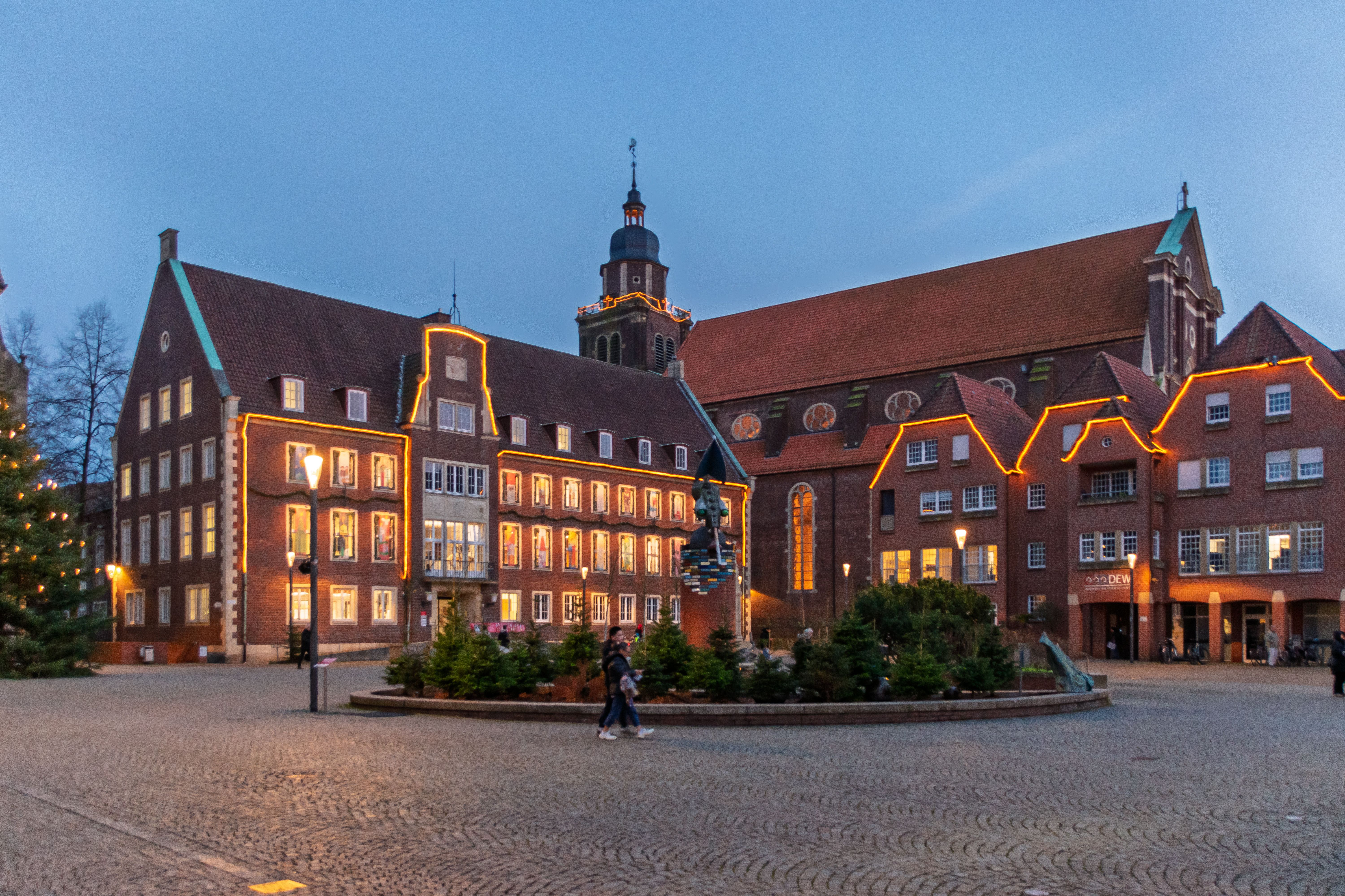 Historic European Square with Illuminated Buildings · Free Stock Photo
