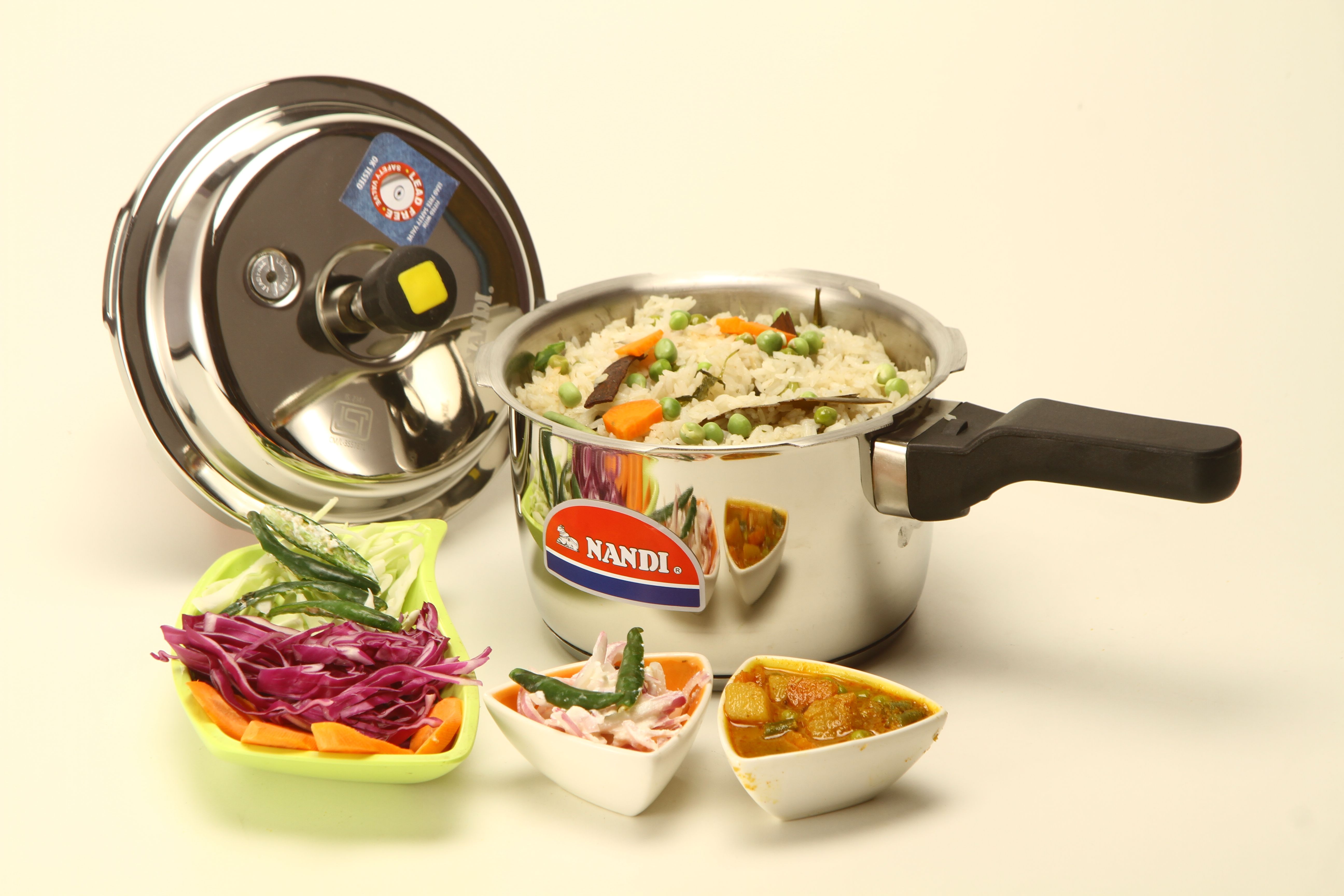 Indian Cuisine in Pressure Cooker on White Background · Free Stock Photo