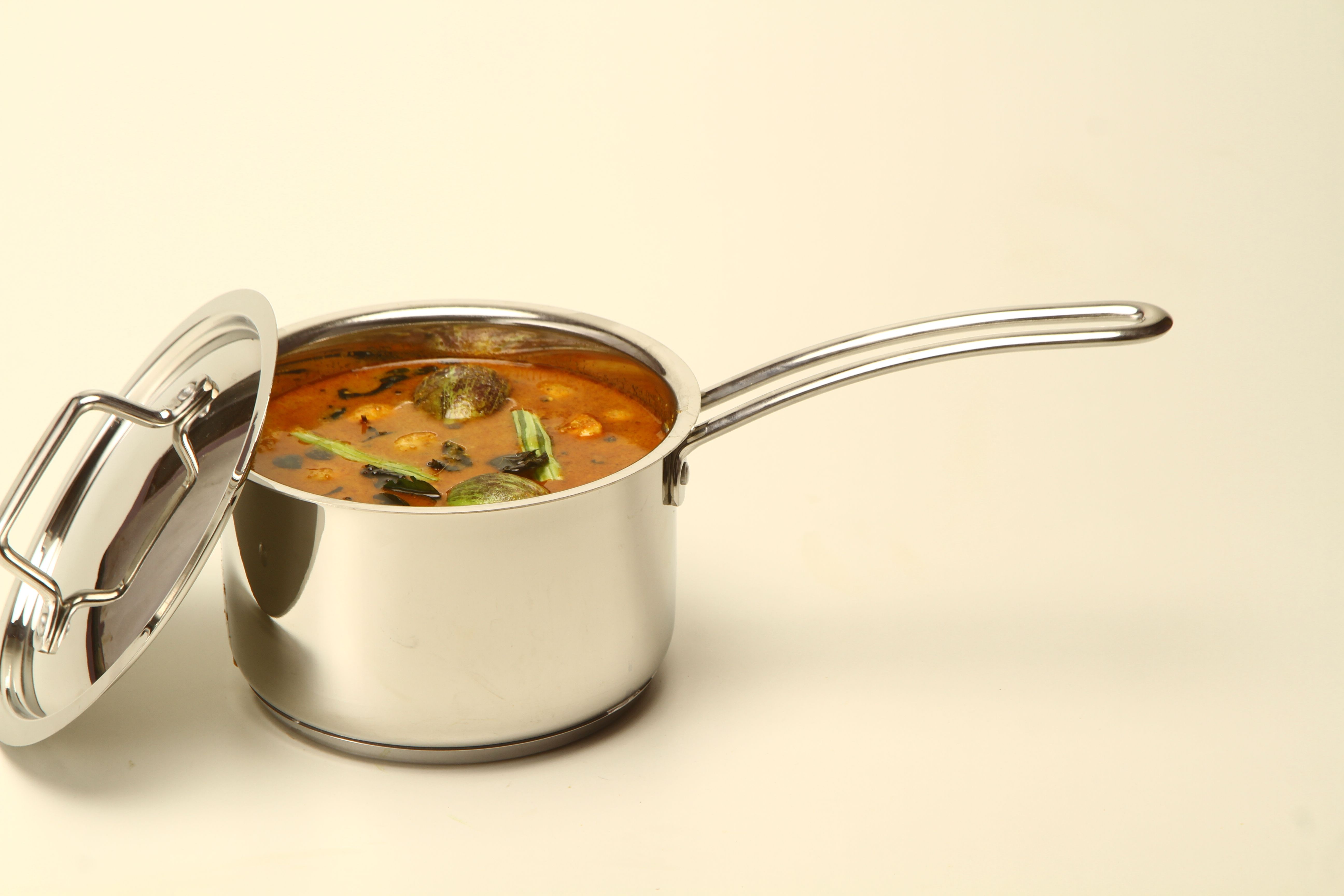 Stainless Steel Pot with Indian Curry and Curry Leaves · Free Stock Photo