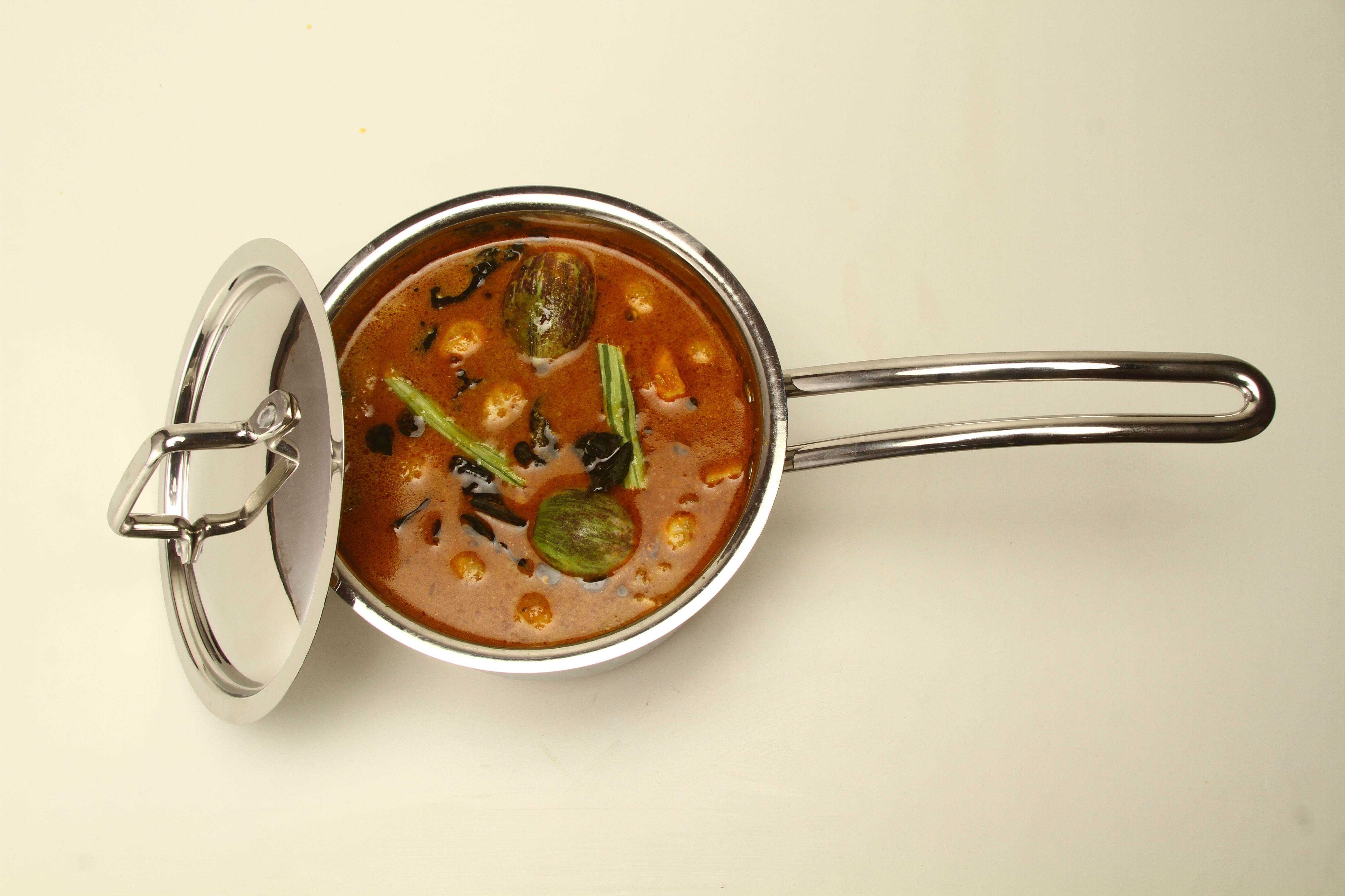 Indian curry in stainless steel pot with lid · Free Stock Photo