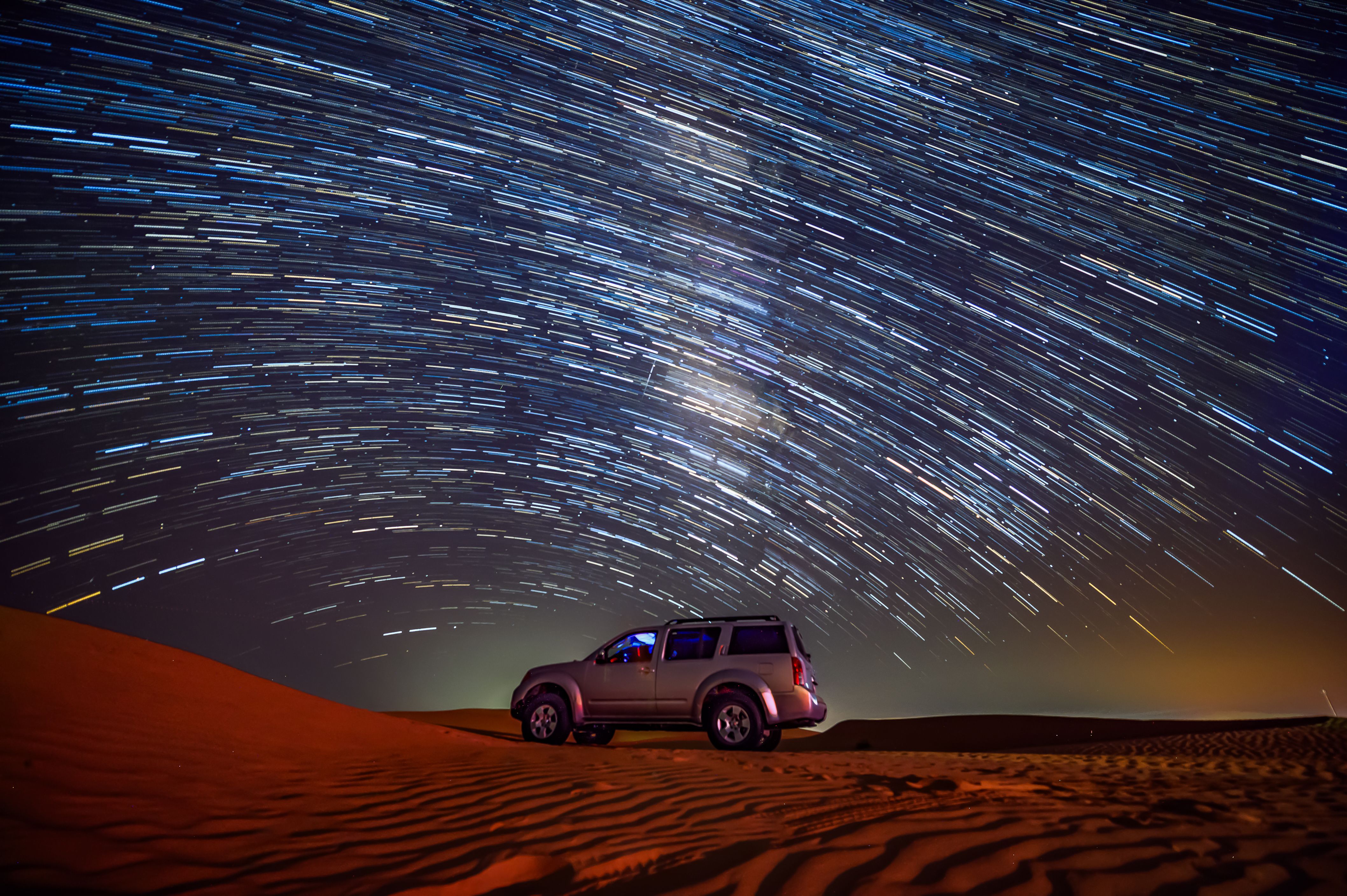 Spectacular Star Trails Over Desert SUV at Night · Free Stock Photo