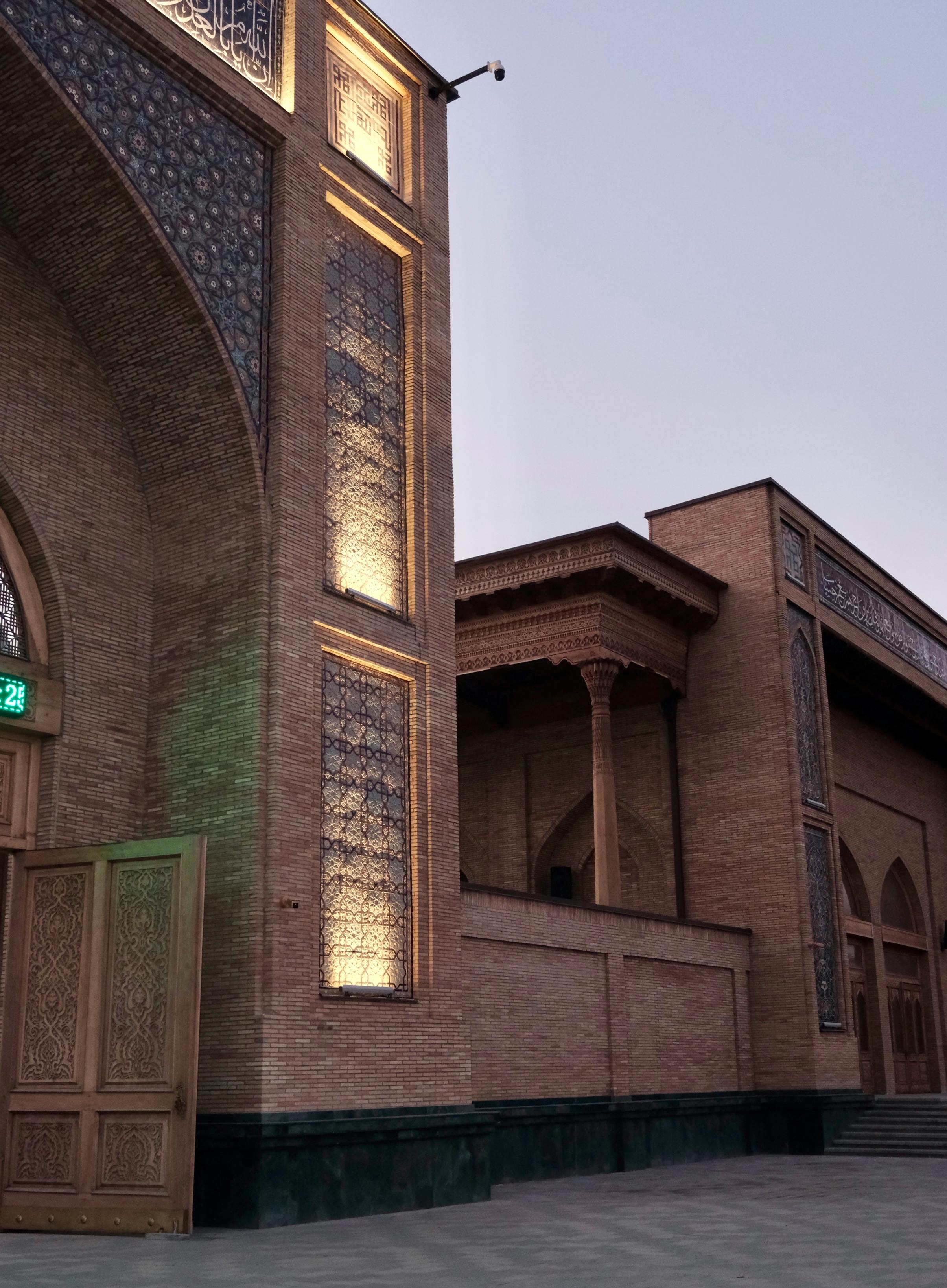 Illuminated Brick Architecture at Dusk · Free Stock Photo