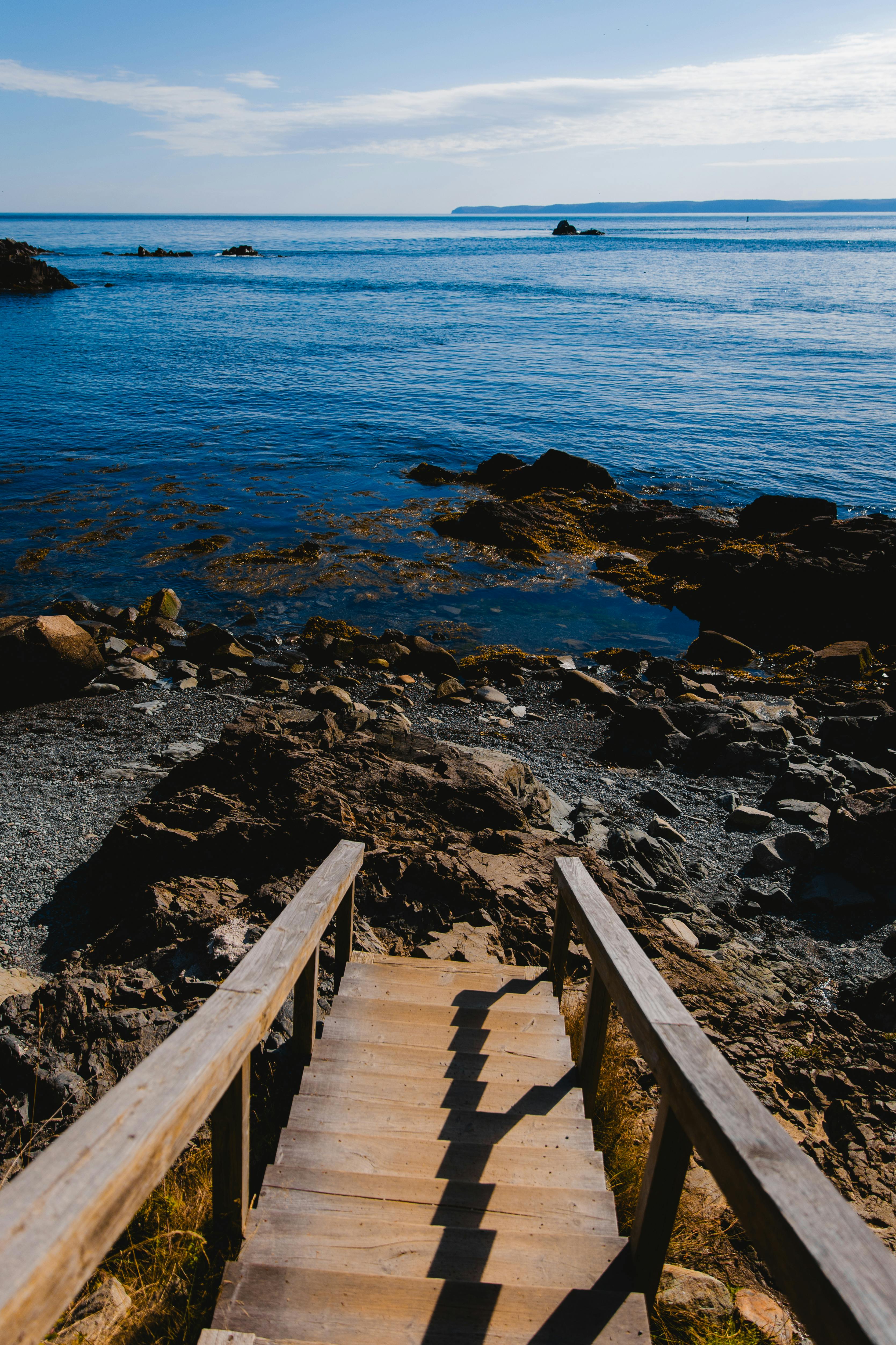 Scenic Coastal View from Rustic Wooden Stairs · Free Stock Photo