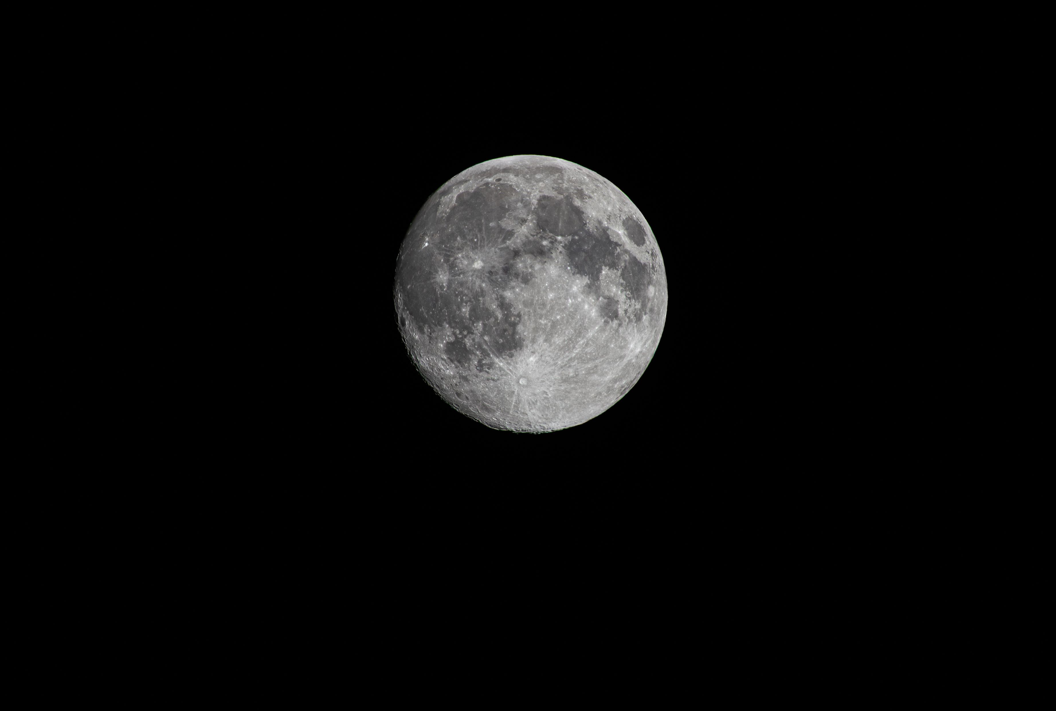High Contrast Full Moon Against Dark Sky · Free Stock Photo