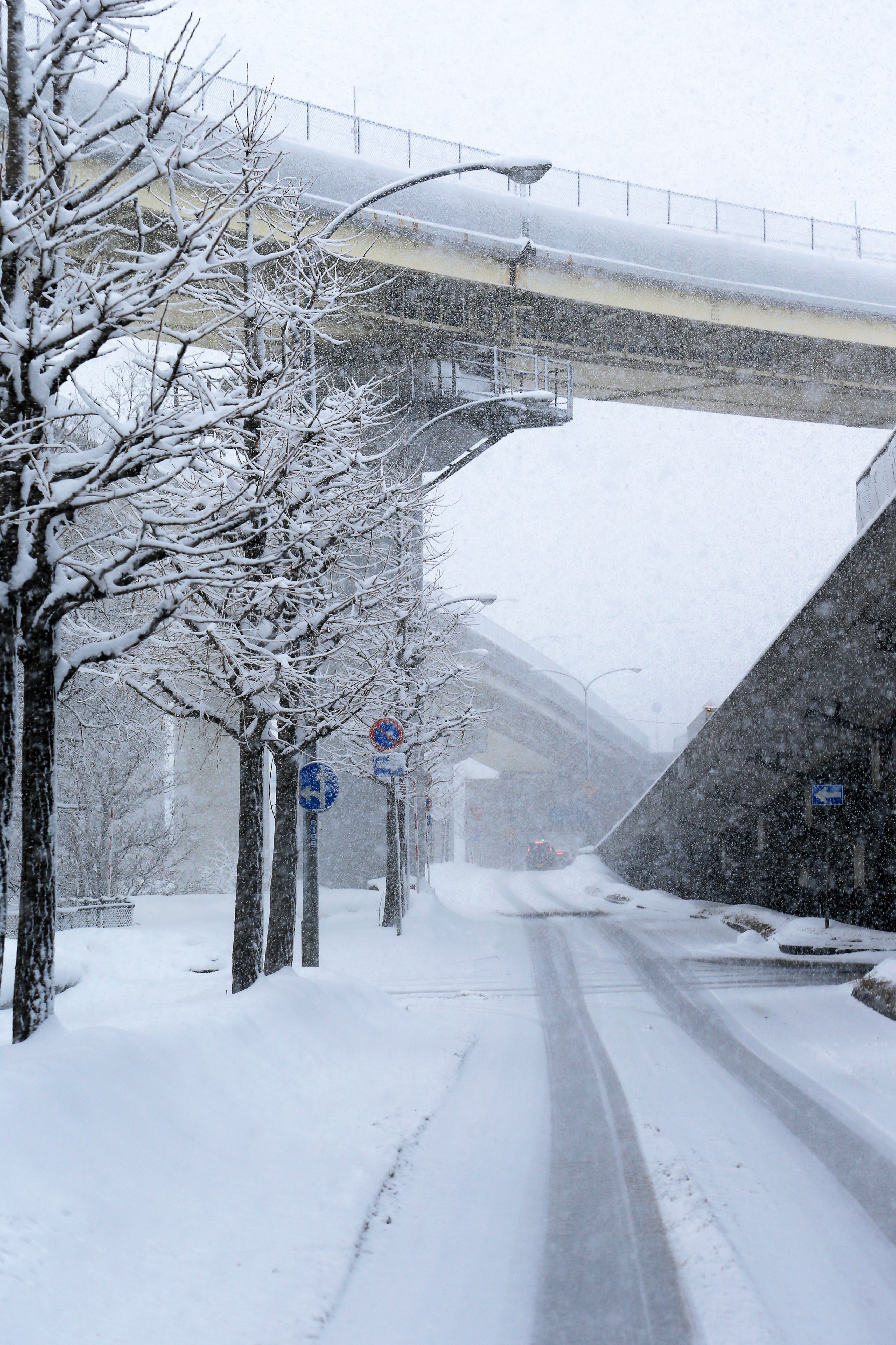 Snowy Winter Cityscape with Overpass · Free Stock Photo