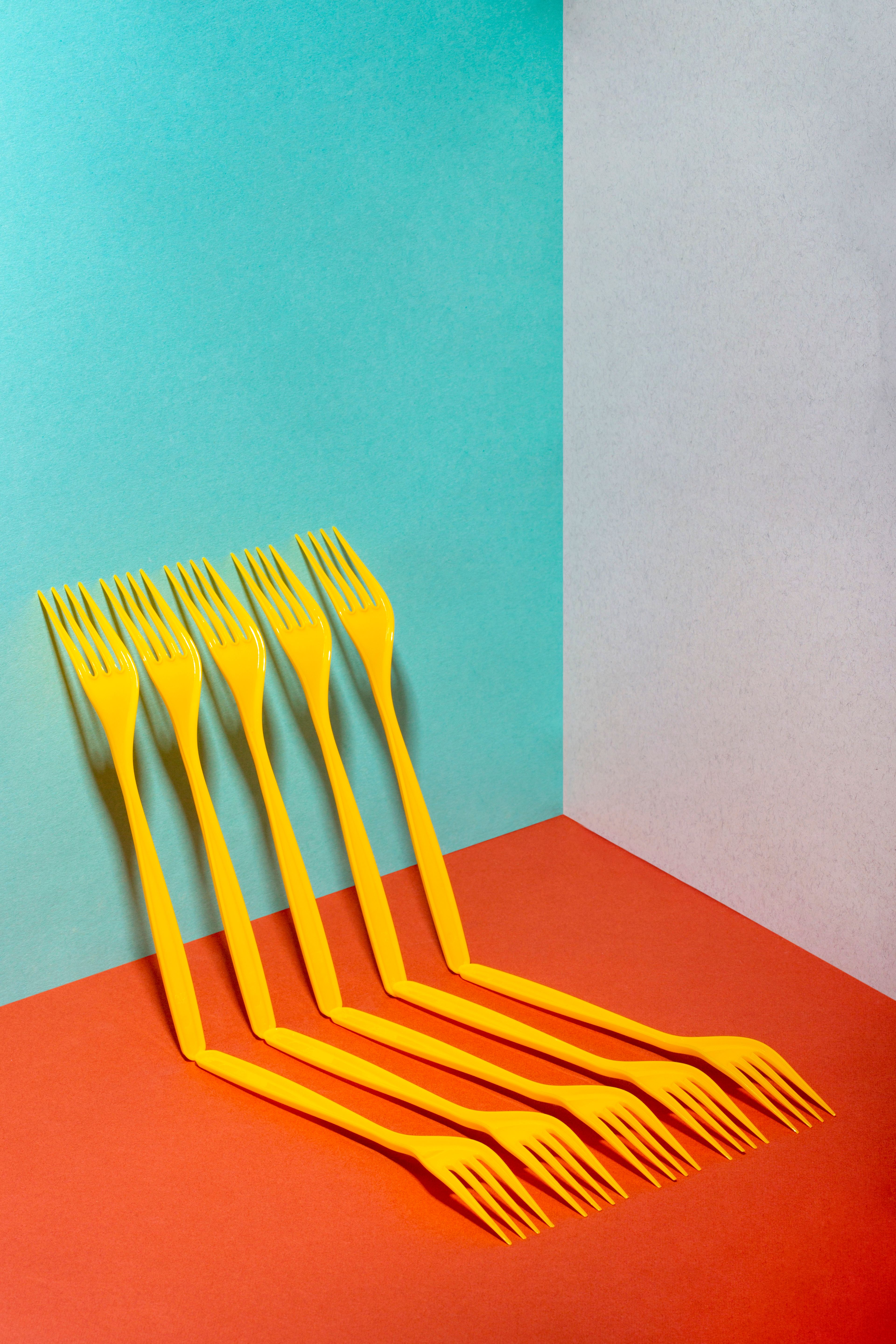 Colorful Composition of Yellow Forks on Tri-Color Background · Free ...