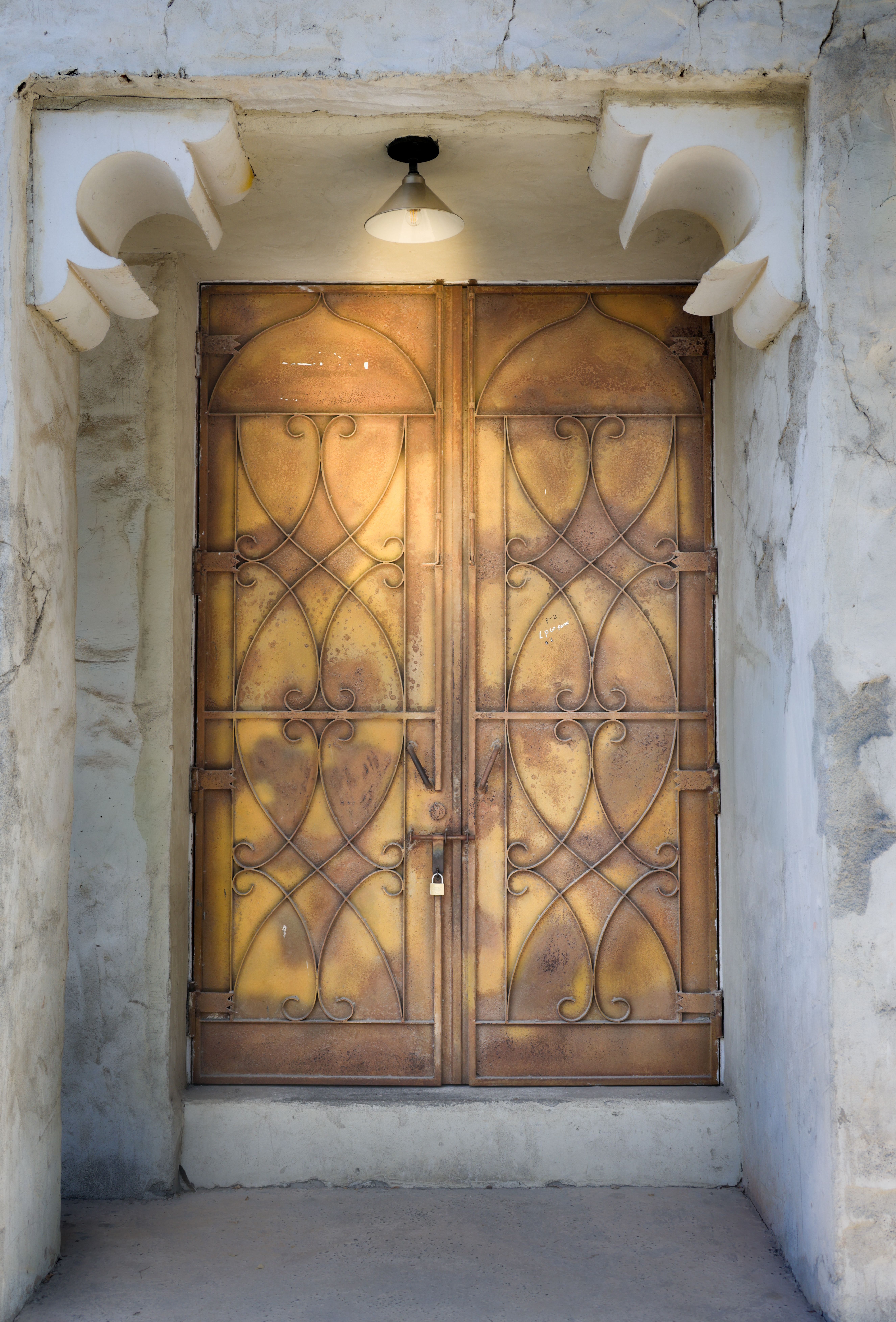 Ornate Rustic Metal Doorway with Vintage Details · Free Stock Photo