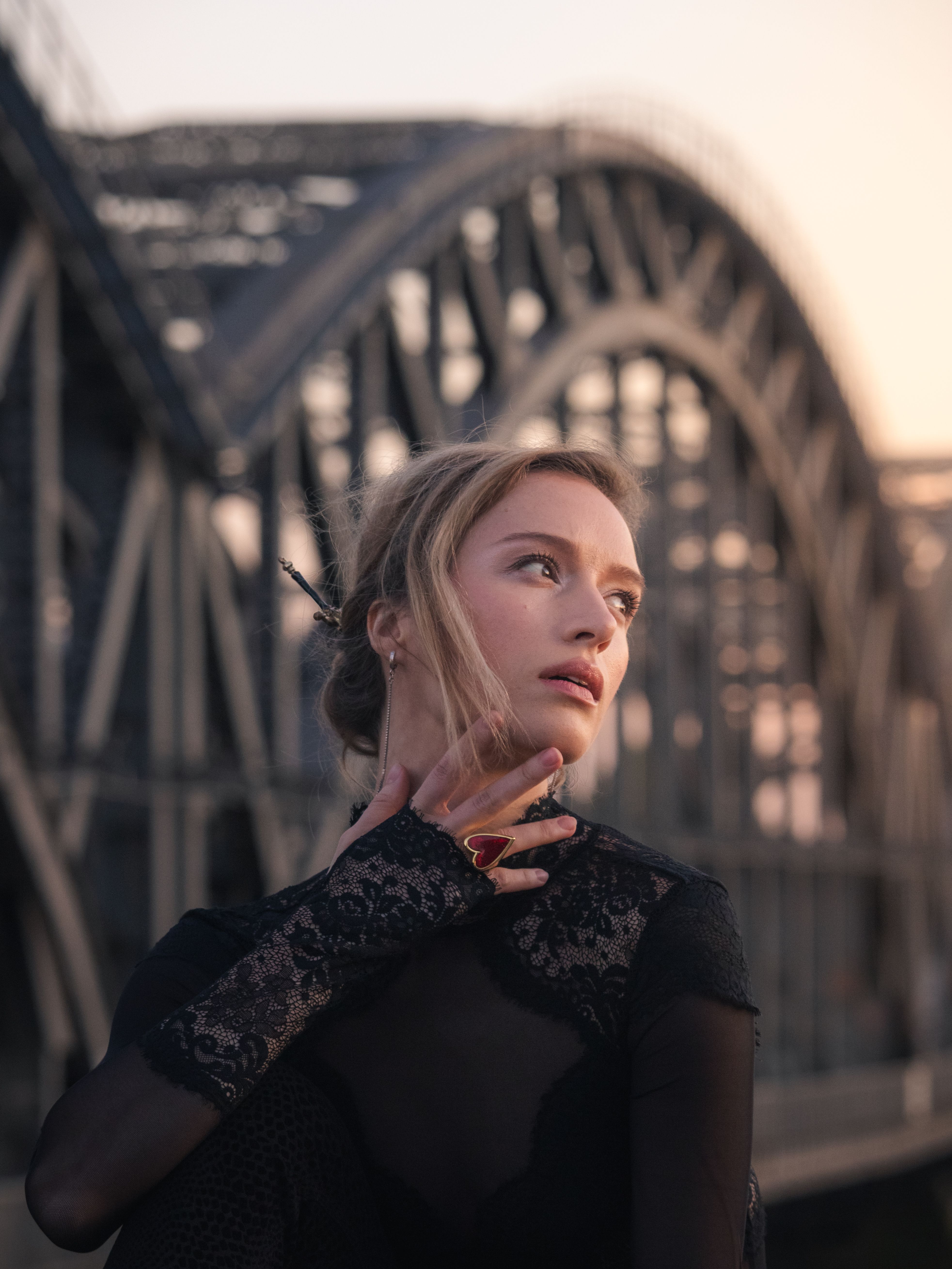 Elegant Portrait in Front of Hamburg's Iconic Bridge · Free Stock Photo